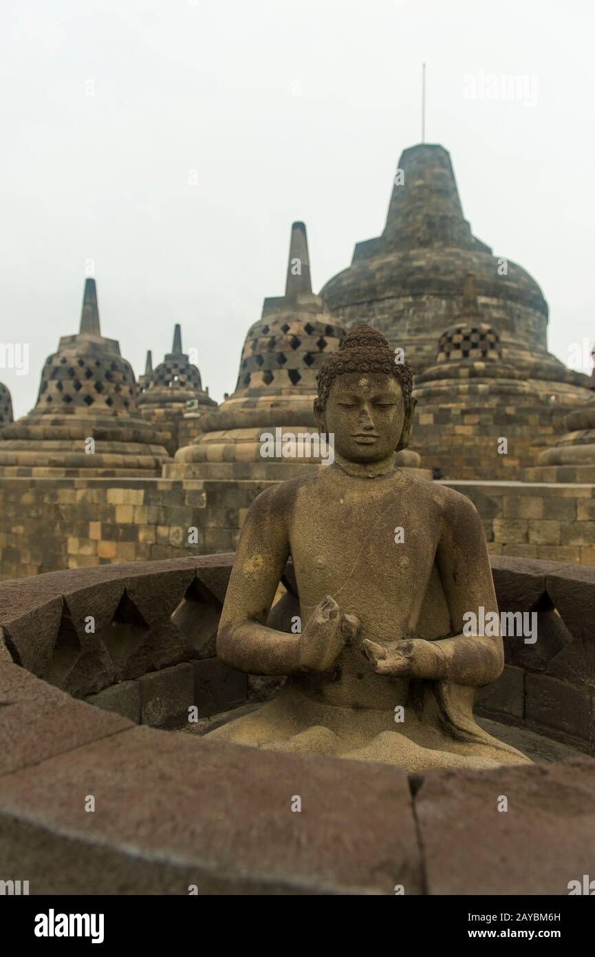 A Buddha statue on an upper platform of Borobudur temple (UNESCO World ...