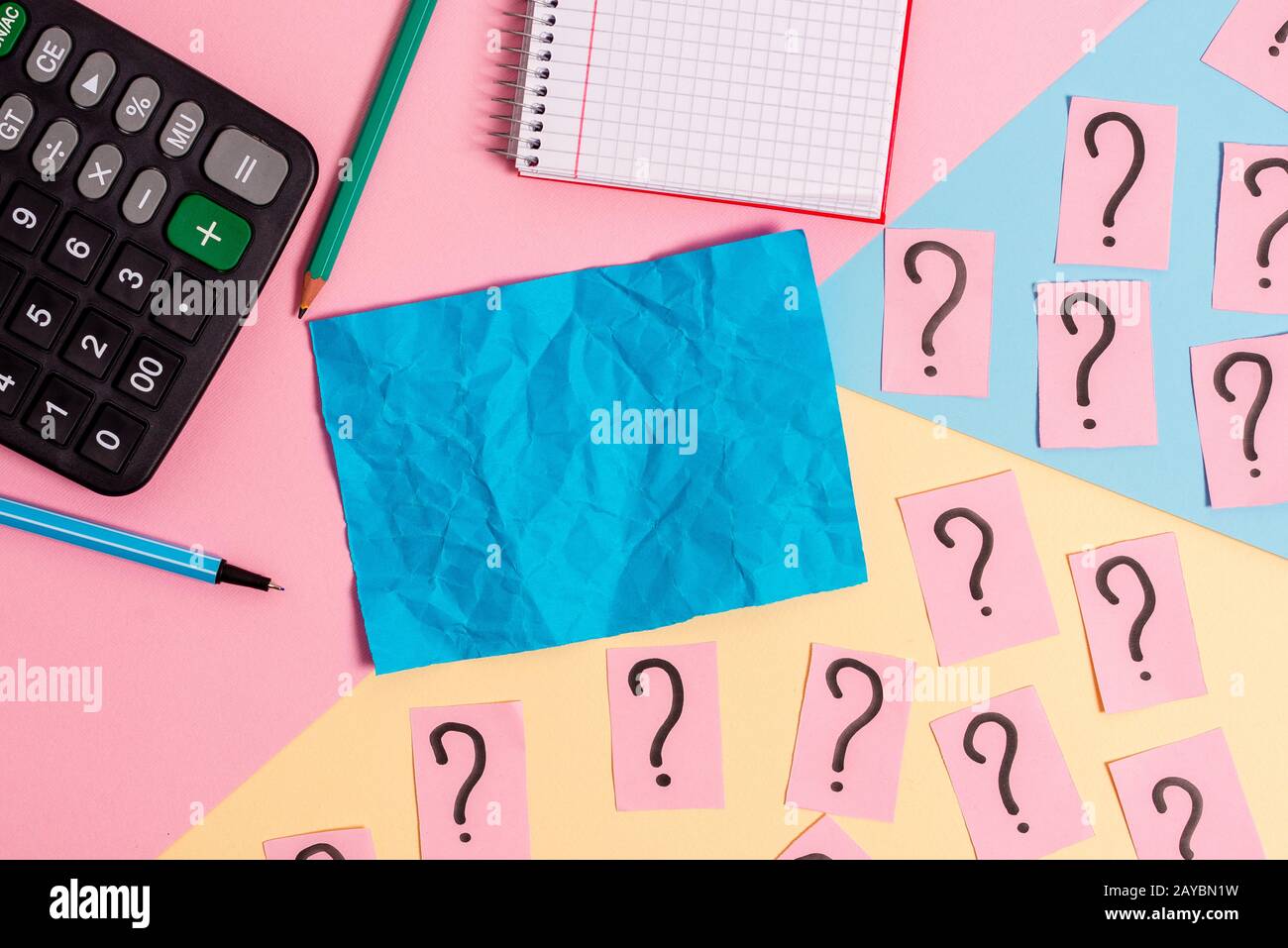 Math stuff with scribbled and crumbling papers plus writing equipment ...