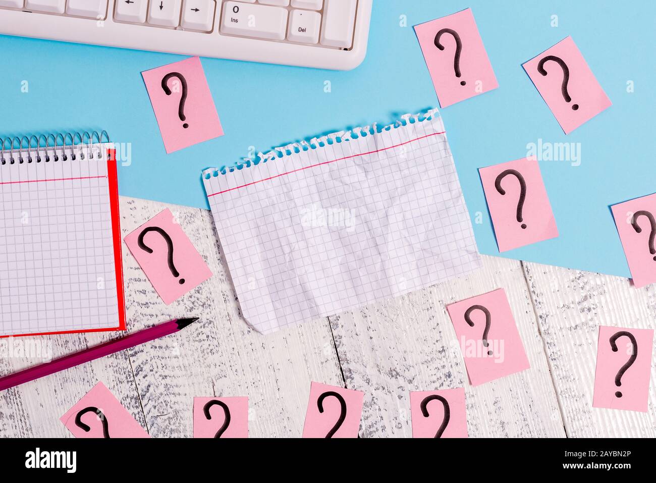 Writing equipment and computer stuff plus scribbled paper placed on a ...