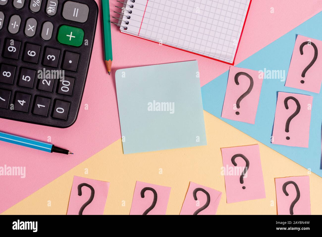 Math stuff with scribbled and crumbling papers plus writing equipment ...