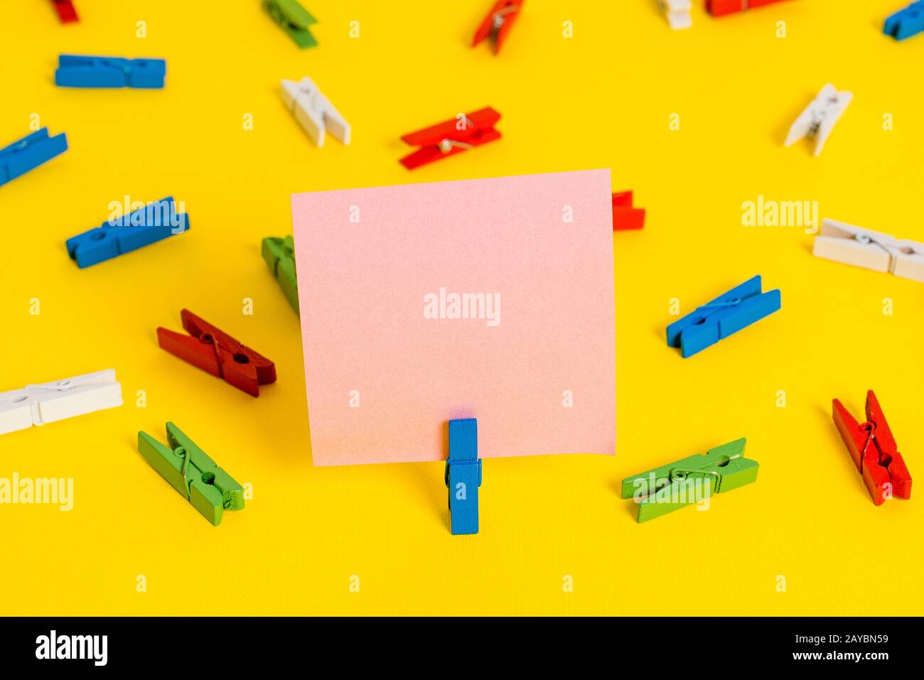 Colored clothespin placed around the empty rectangle square shaped ...