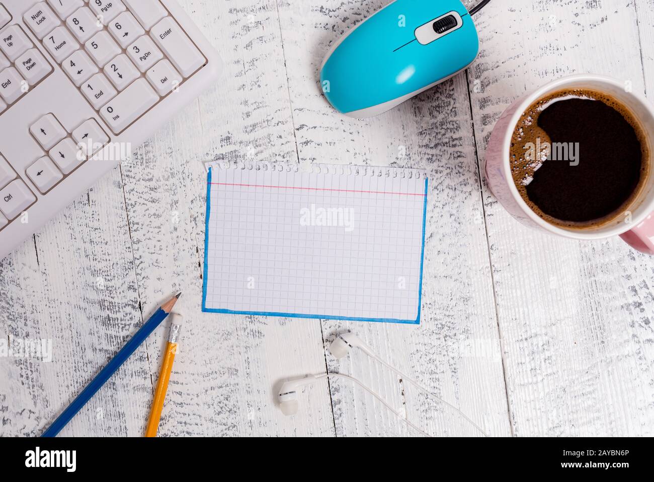 Square rectangle empty paper note above a white wooden floor, computer ...