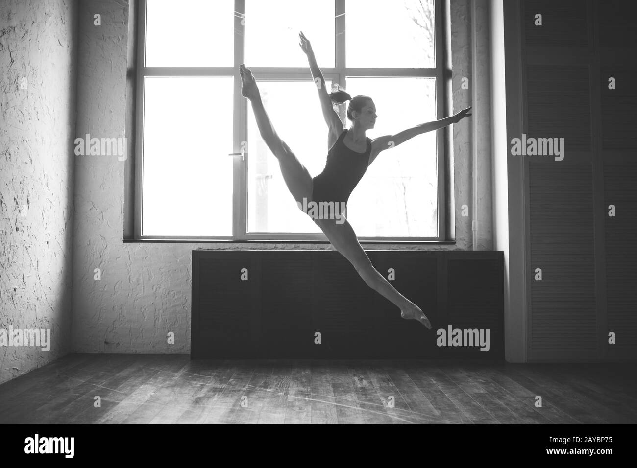 Plasticity slim woman dancing near window. Professional dancer enjoy ...
