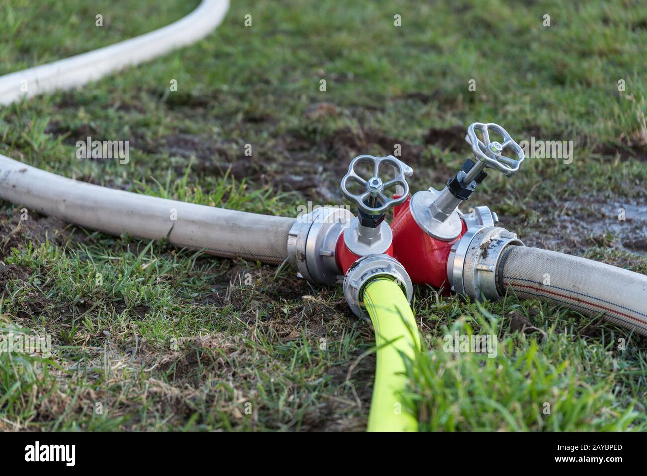 Distributor with fire hose - connected pressure hoses Stock Photo - Alamy
