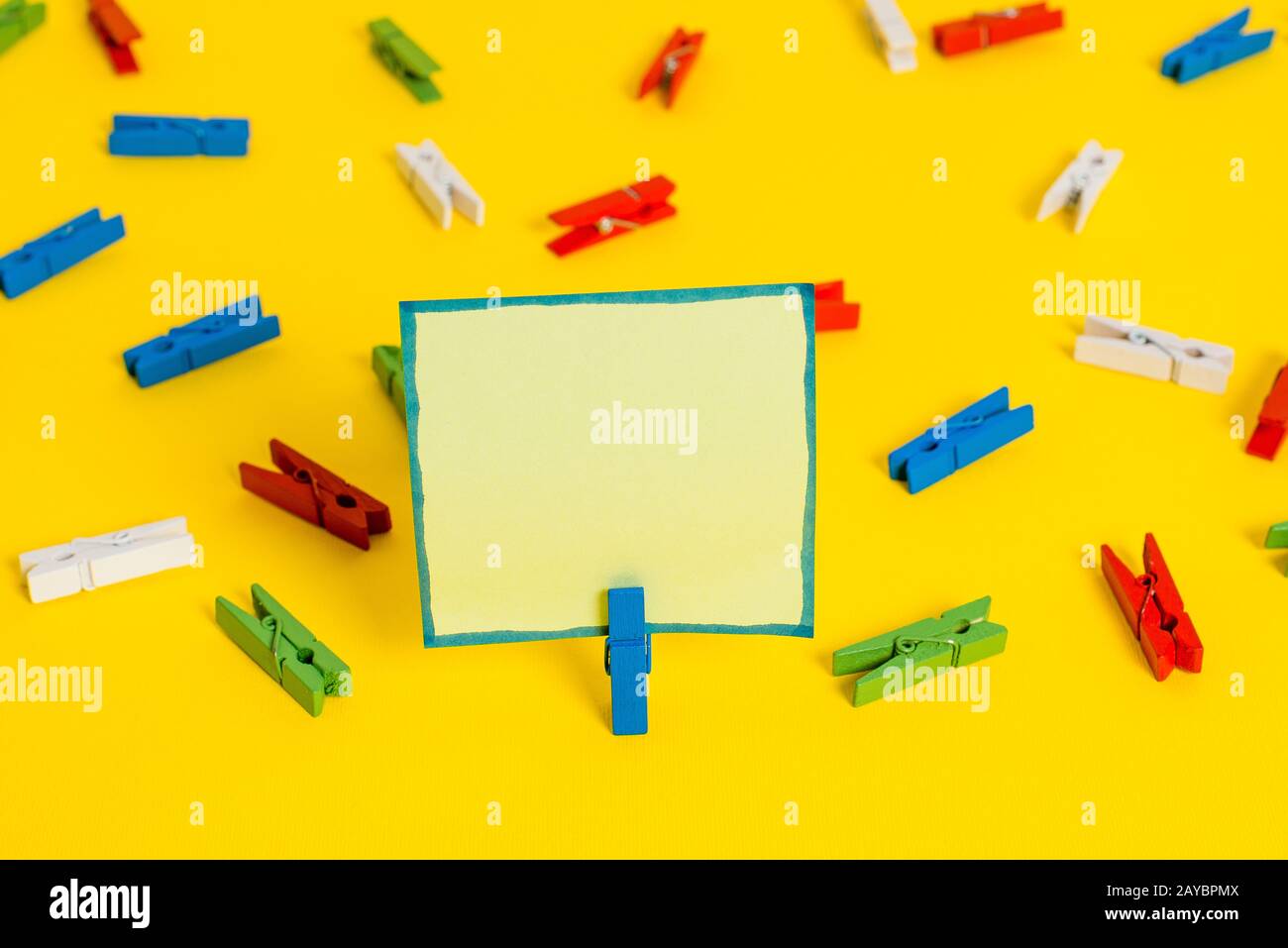 Colored clothespin placed around the empty rectangle square shaped ...
