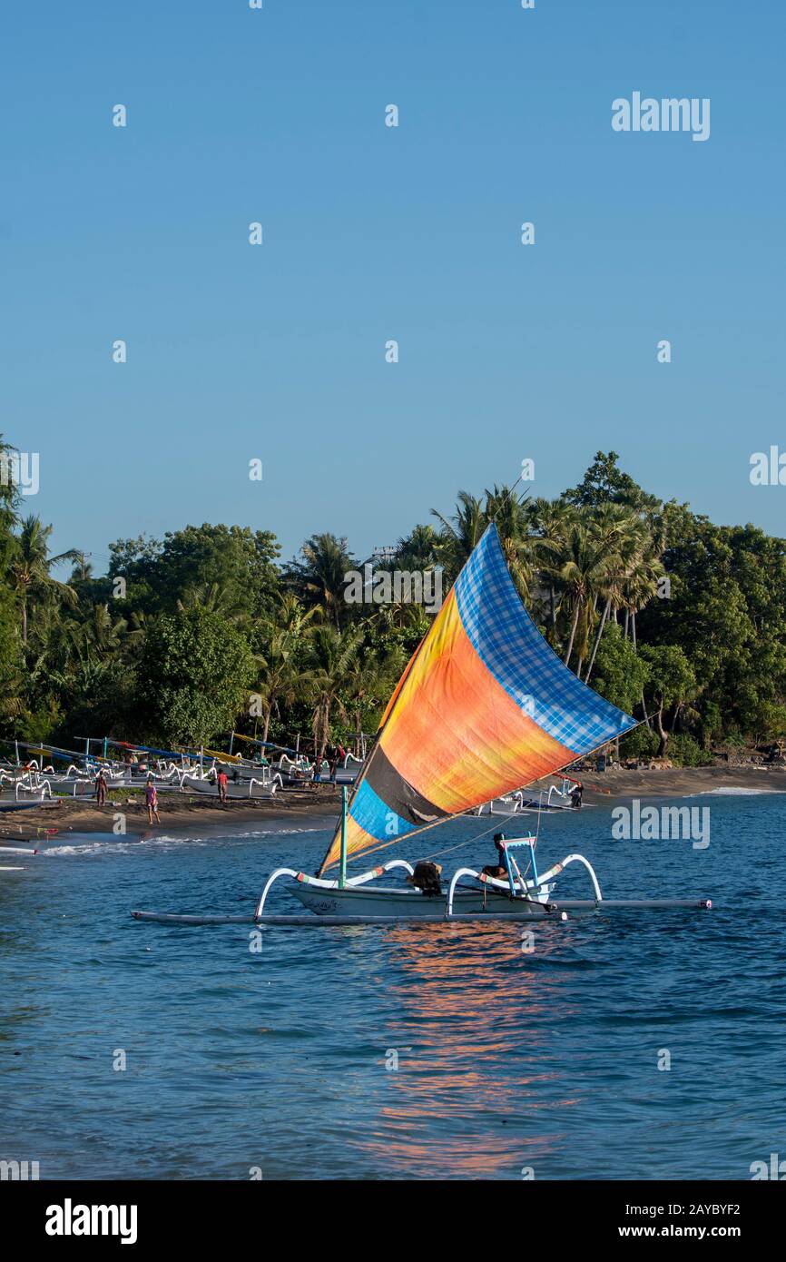 Traditional Balinese fishing boats (Junkung) landing on a beach in Amed ...
