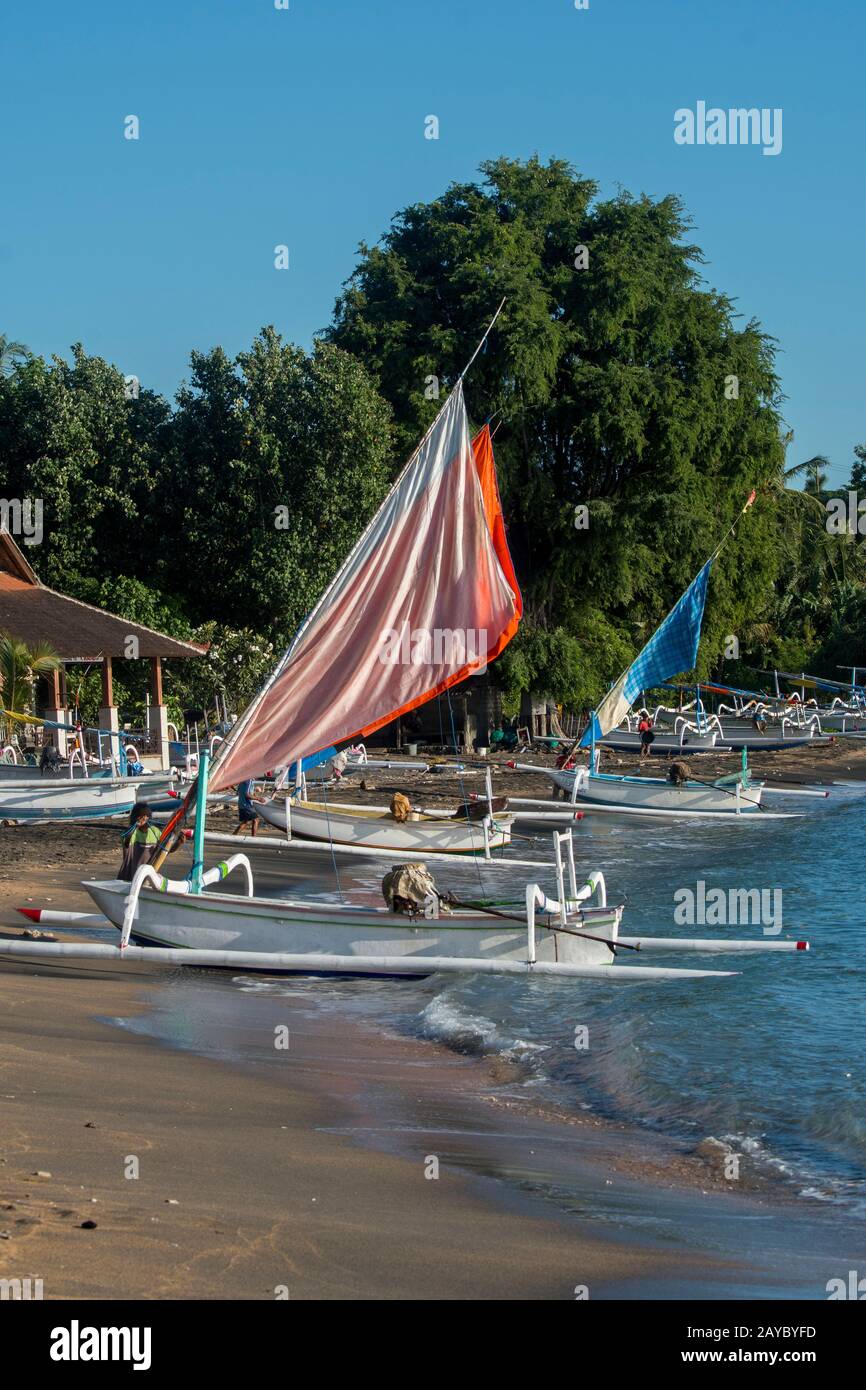 Traditional Balinese fishing boats (Junkung) landing on a beach in Amed ...