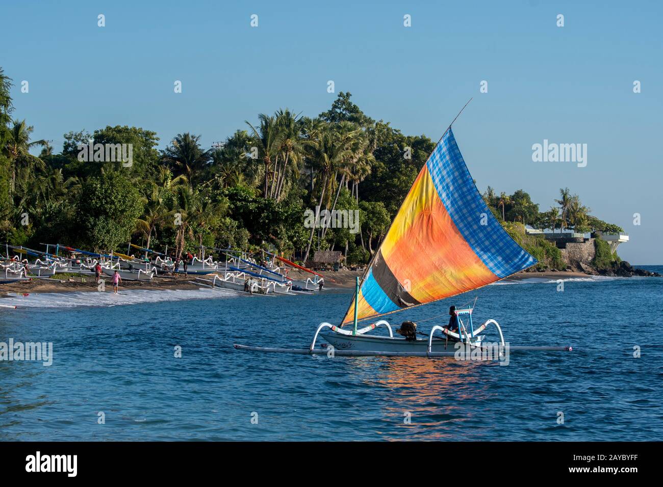 Traditional Balinese fishing boats (Junkung) landing on a beach in Amed ...