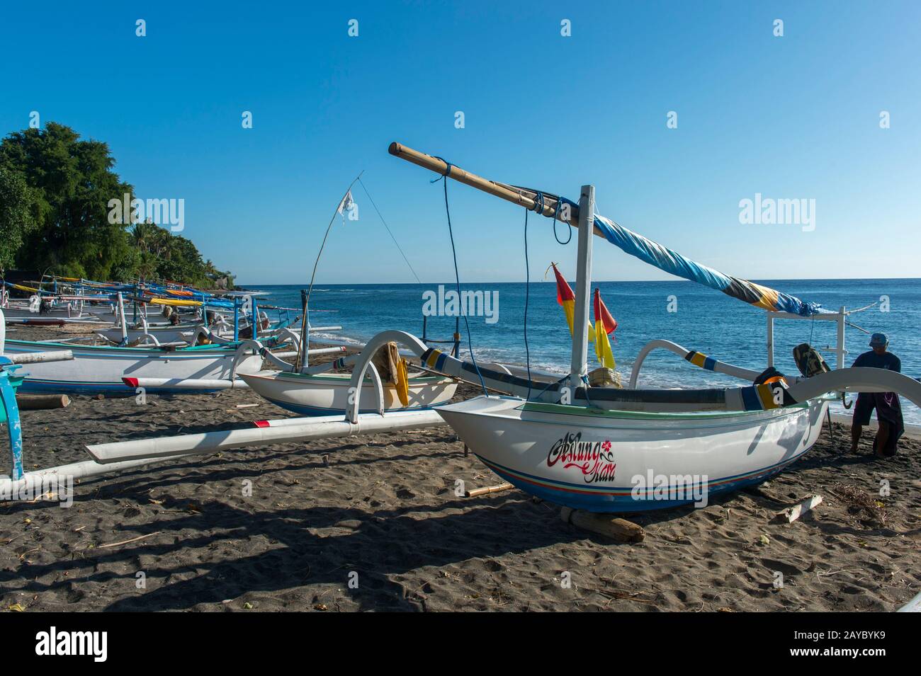 Traditional Balinese fishing boats (Junkung) on a beach in Amed, East ...