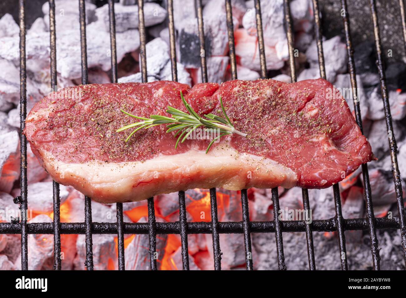 Steak ready for grilling Stock Photo - Alamy