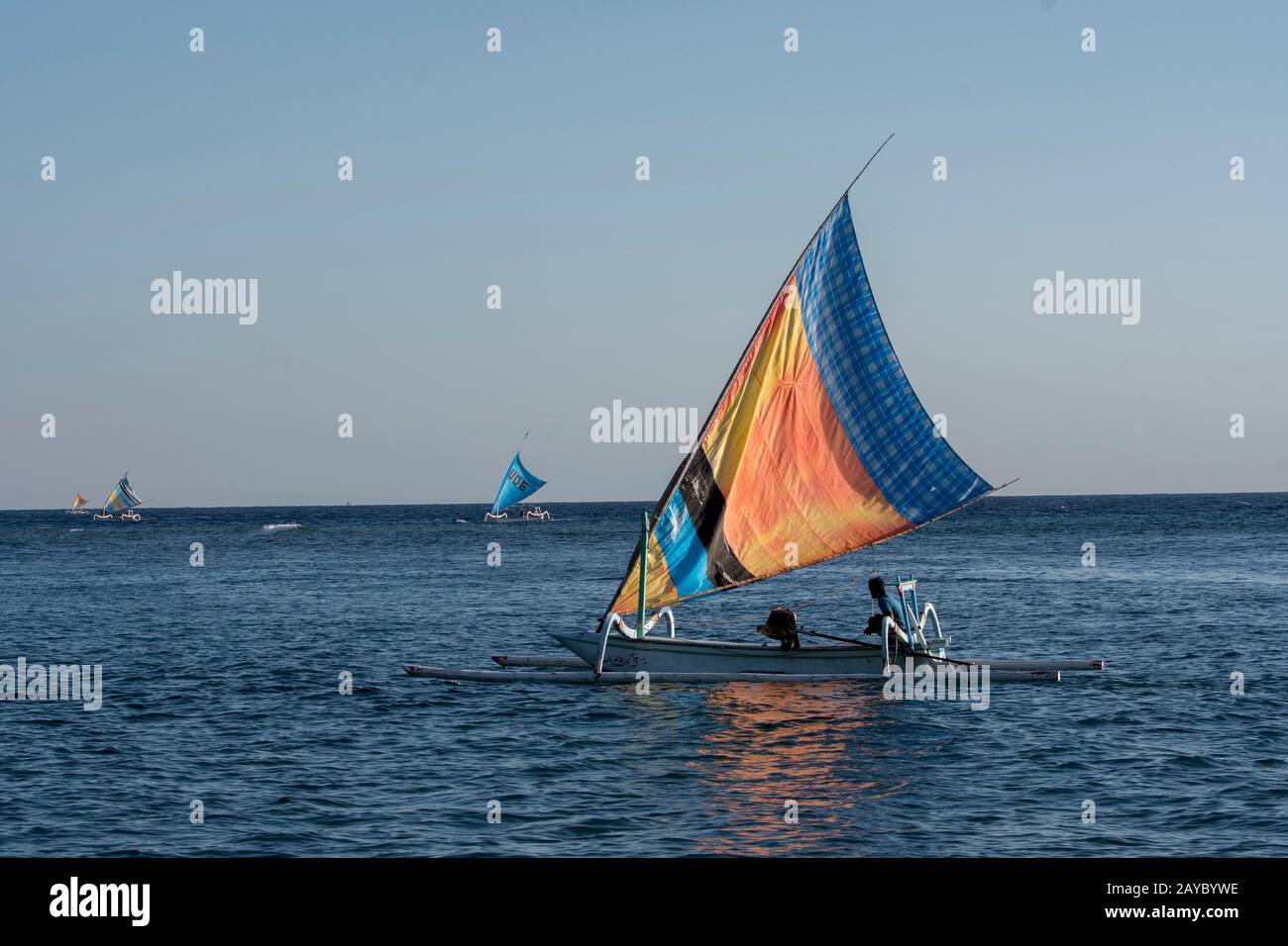 A traditional Balinese fishing boat (Junkung) at sea in front of Amed ...