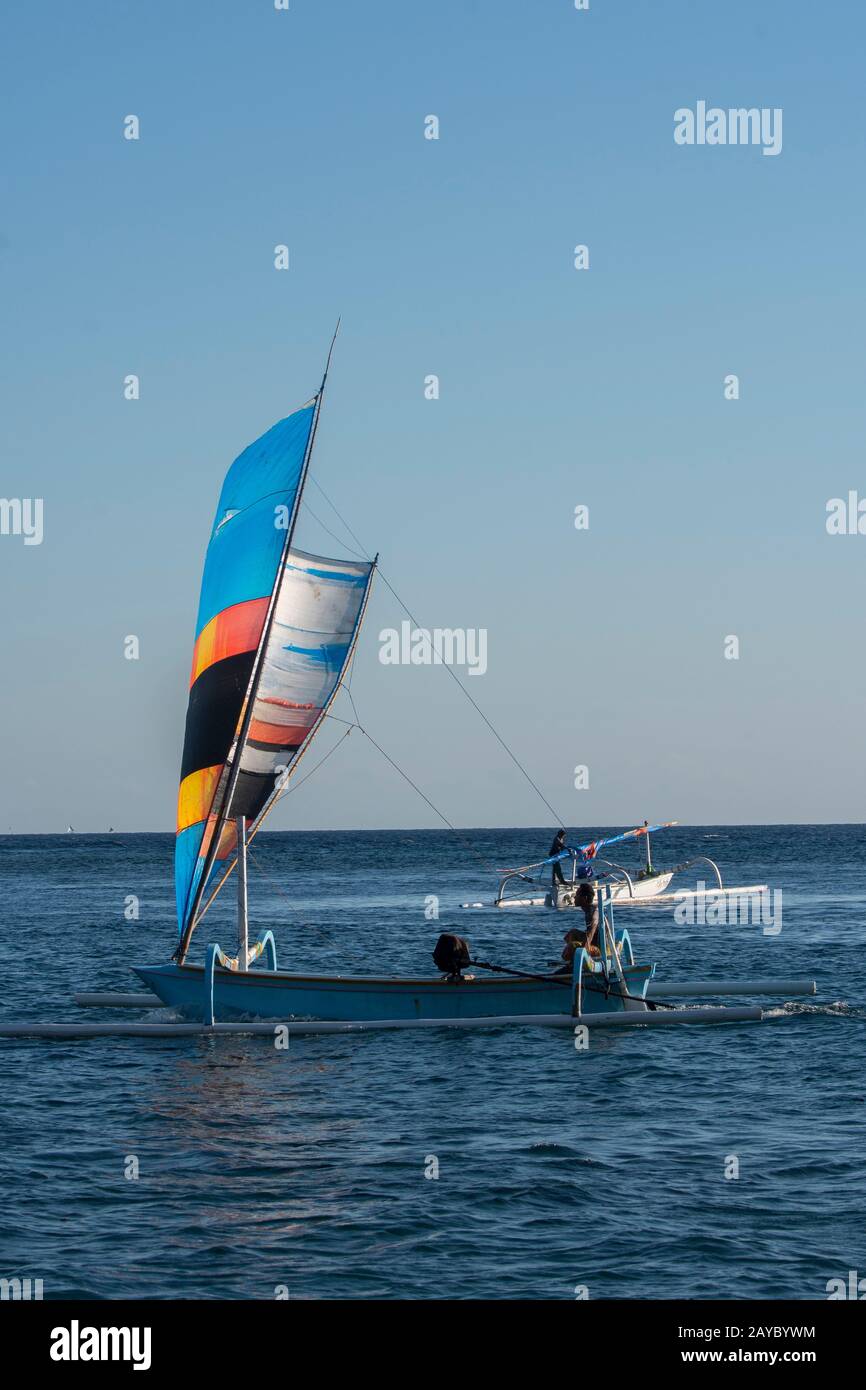 A traditional Balinese fishing boat (Junkung) at sea in front of Amed ...