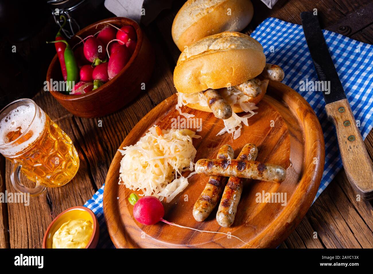 rustic Thuringian bratwurst with sauerkraut and roll Stock Photo - Alamy