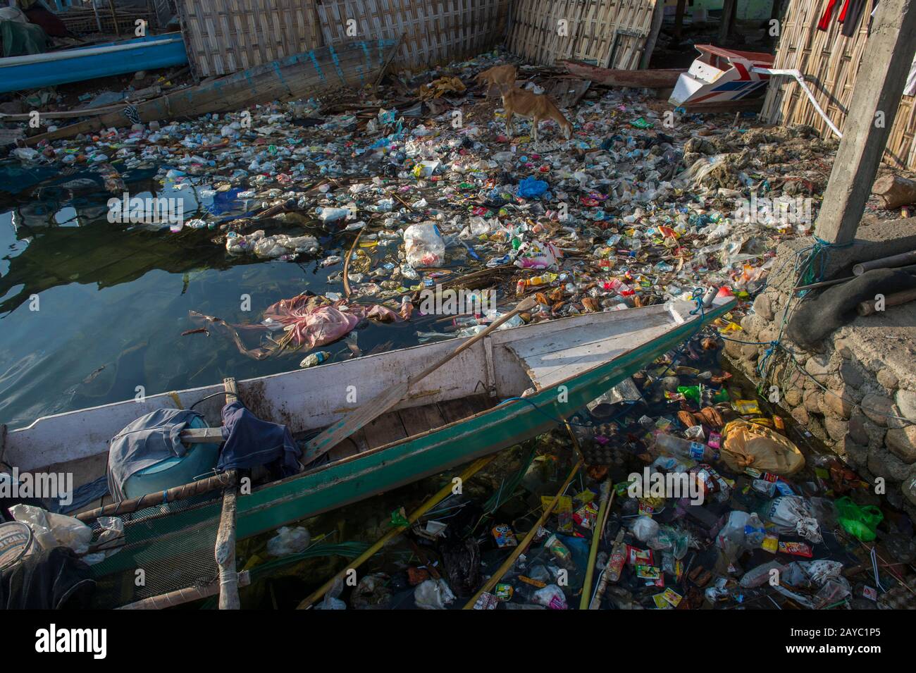 Garbage, mostly plastic, floating on the water at the Bajau Sea Gypsy ...