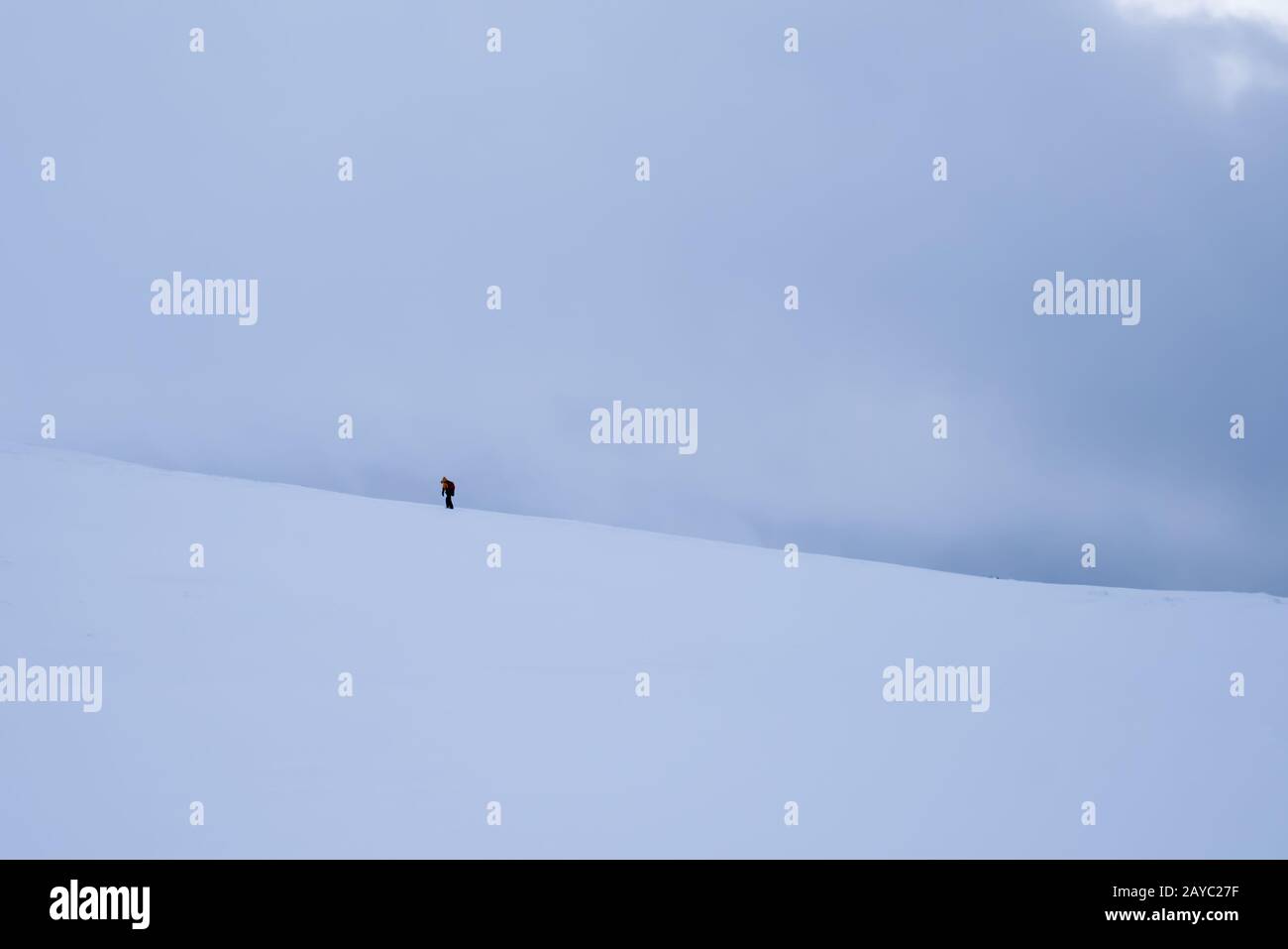Trekker walking towards Storsteinen mountain summit Stock Photo - Alamy
