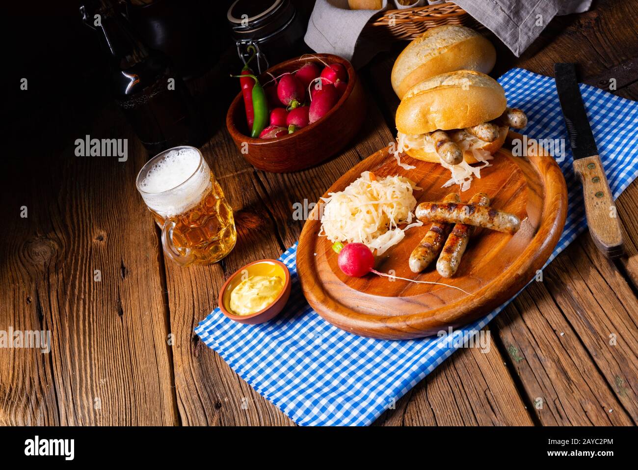 rustic Thuringian bratwurst with sauerkraut and roll Stock Photo - Alamy