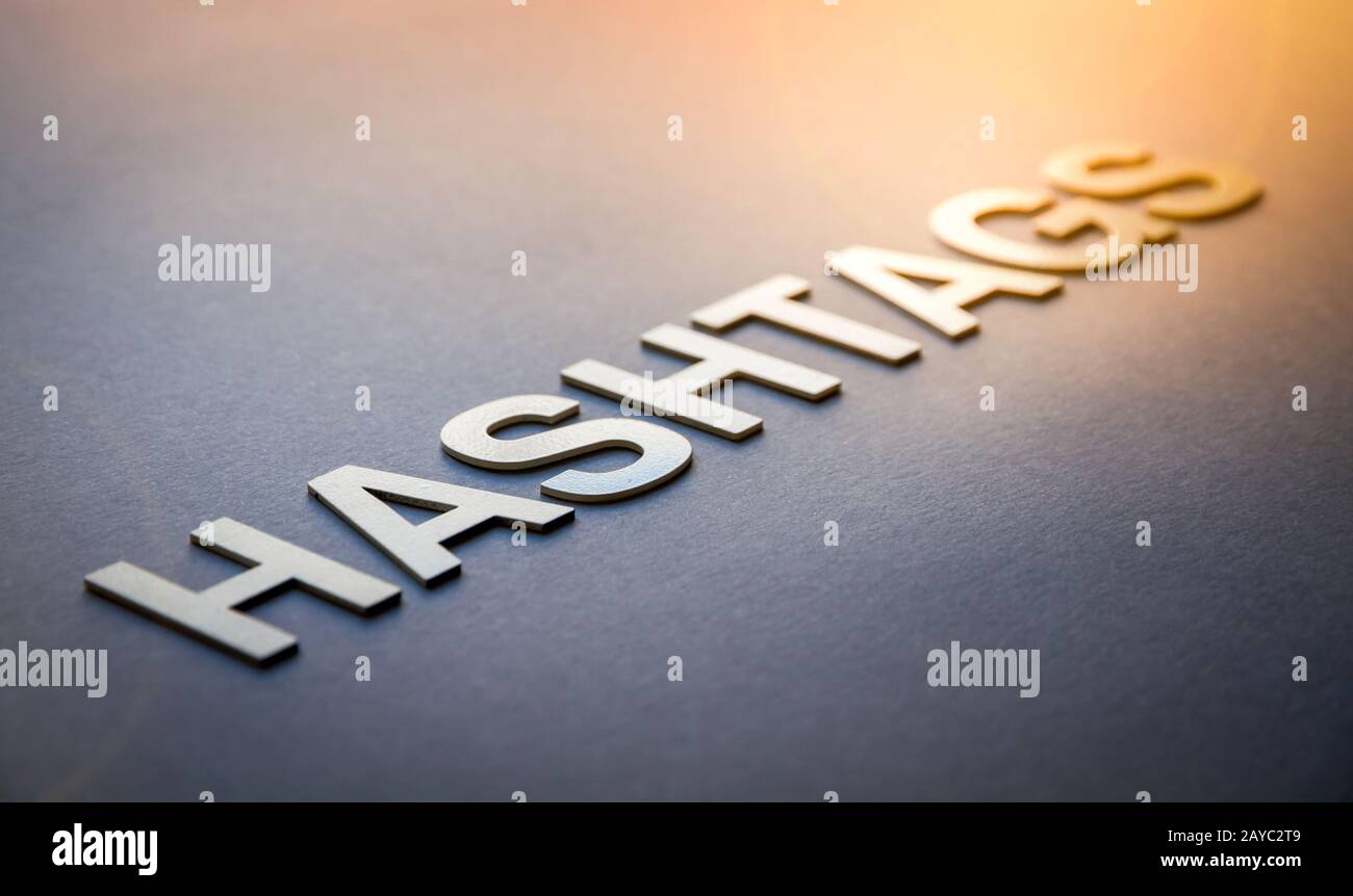 Word hashtags written with white solid letters Stock Photo - Alamy