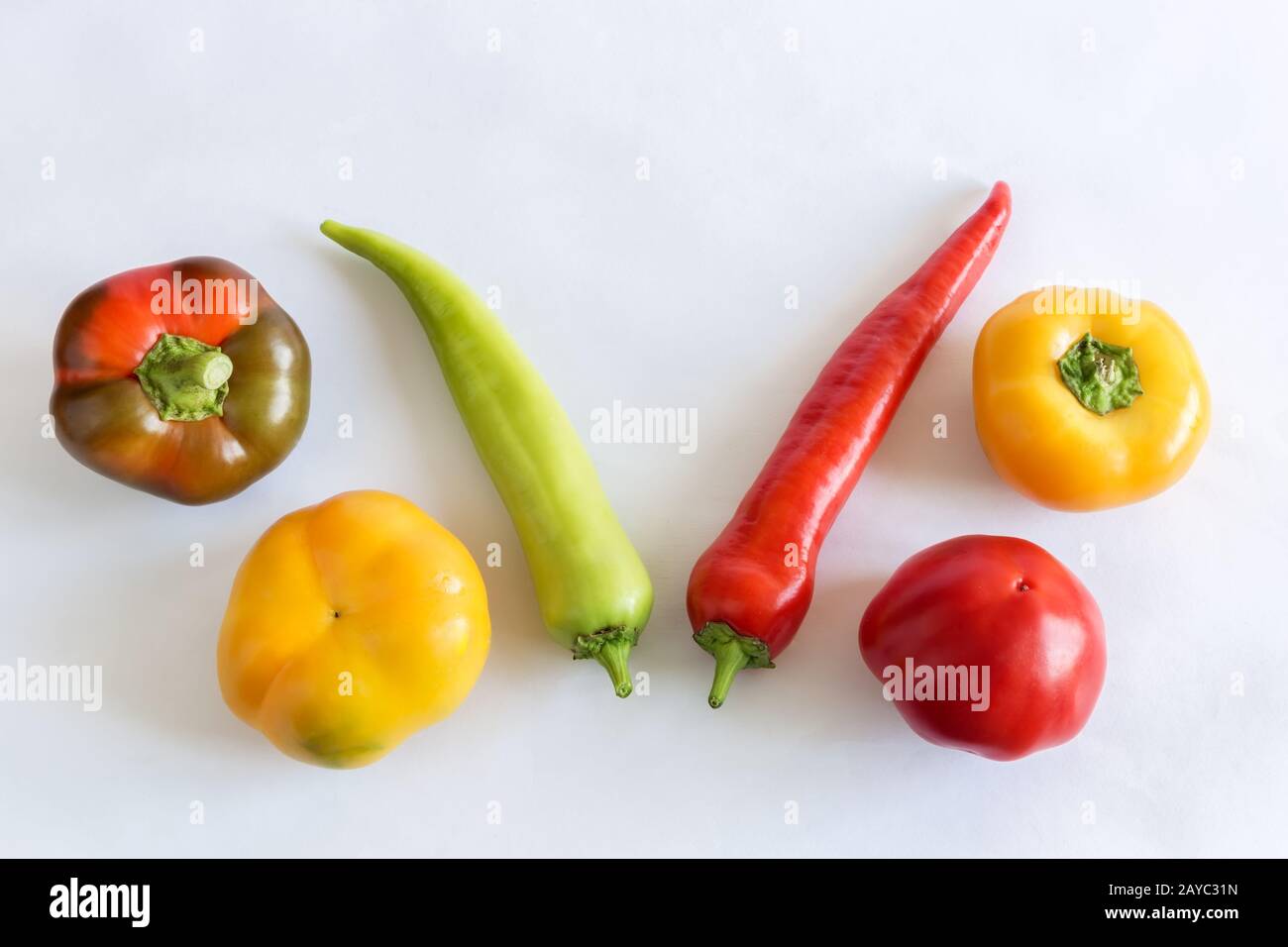 Six bell peppers on a light background Stock Photo - Alamy