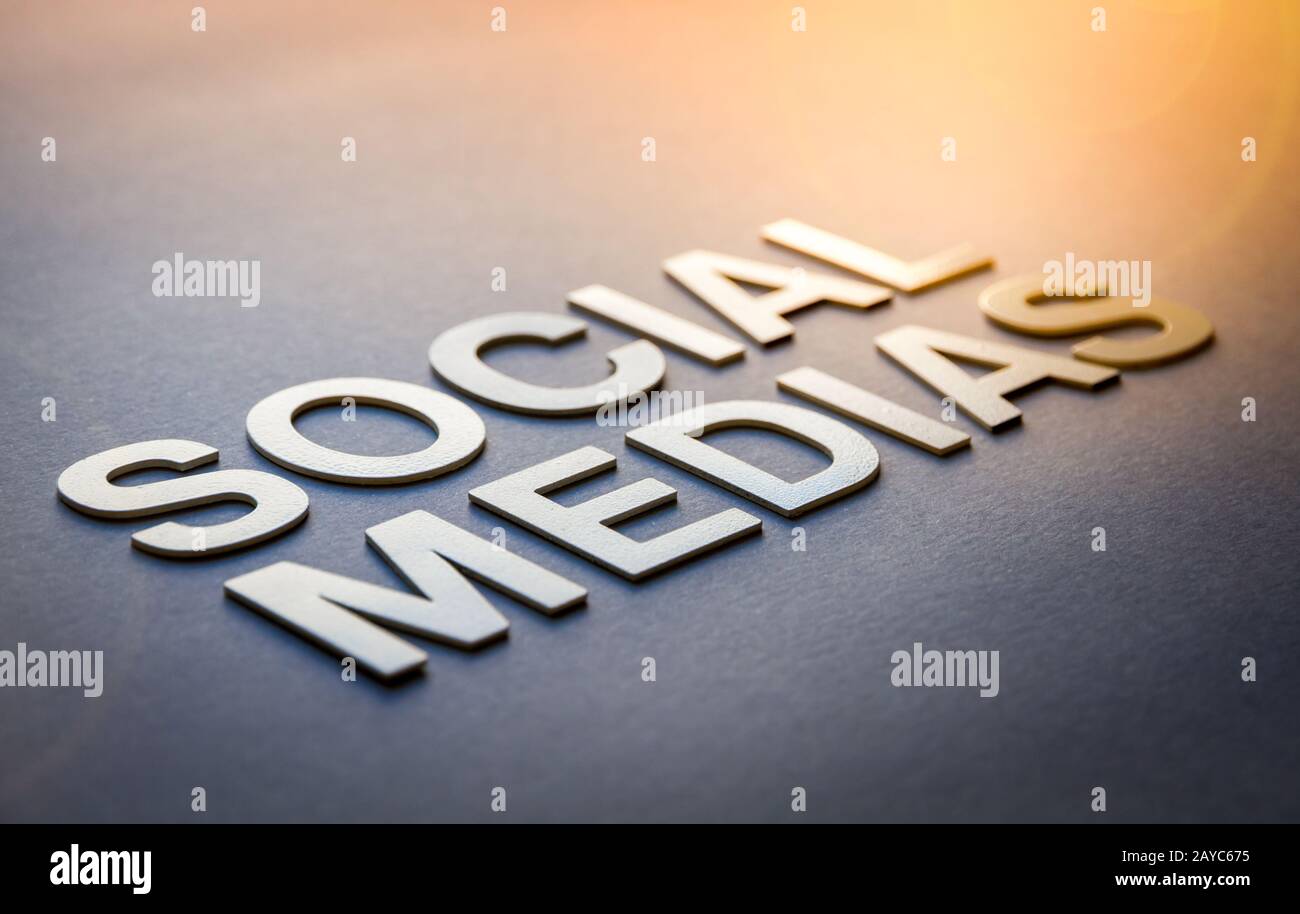 Word social medias written with white solid letters Stock Photo - Alamy
