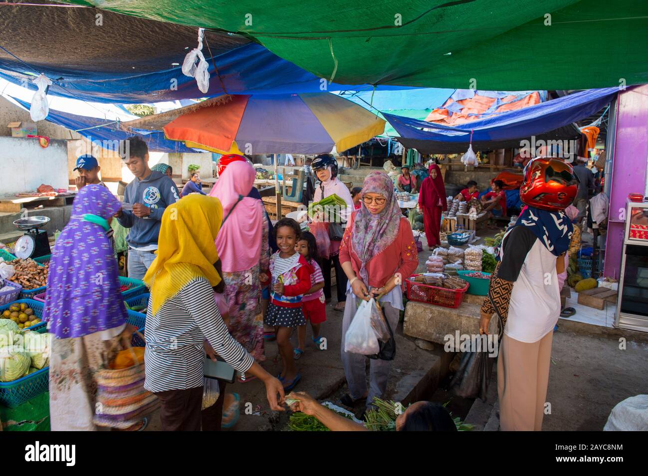A colorful market scene at the market in Labuan Bajo, a fishing town ...