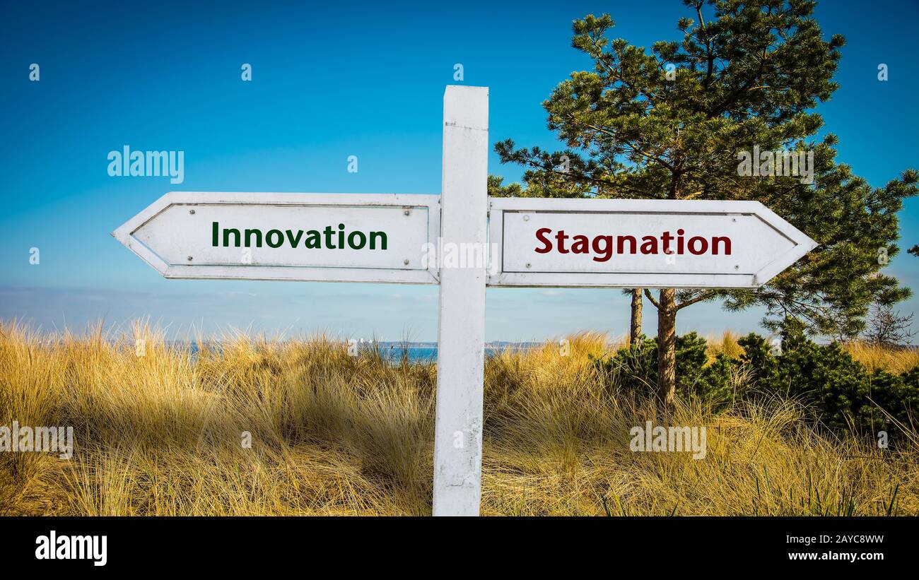 Street Sign Innovation versus Stagnation Stock Photo - Alamy
