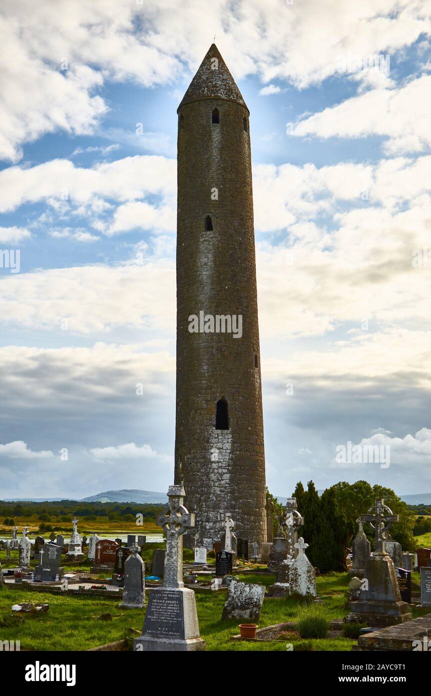 Irish celtic stone tower of a temple. Medieval ruins of a temple and ...