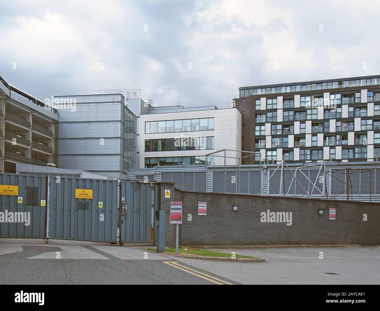 a view of a heavily protected fenced off area with steel gates behind ...
