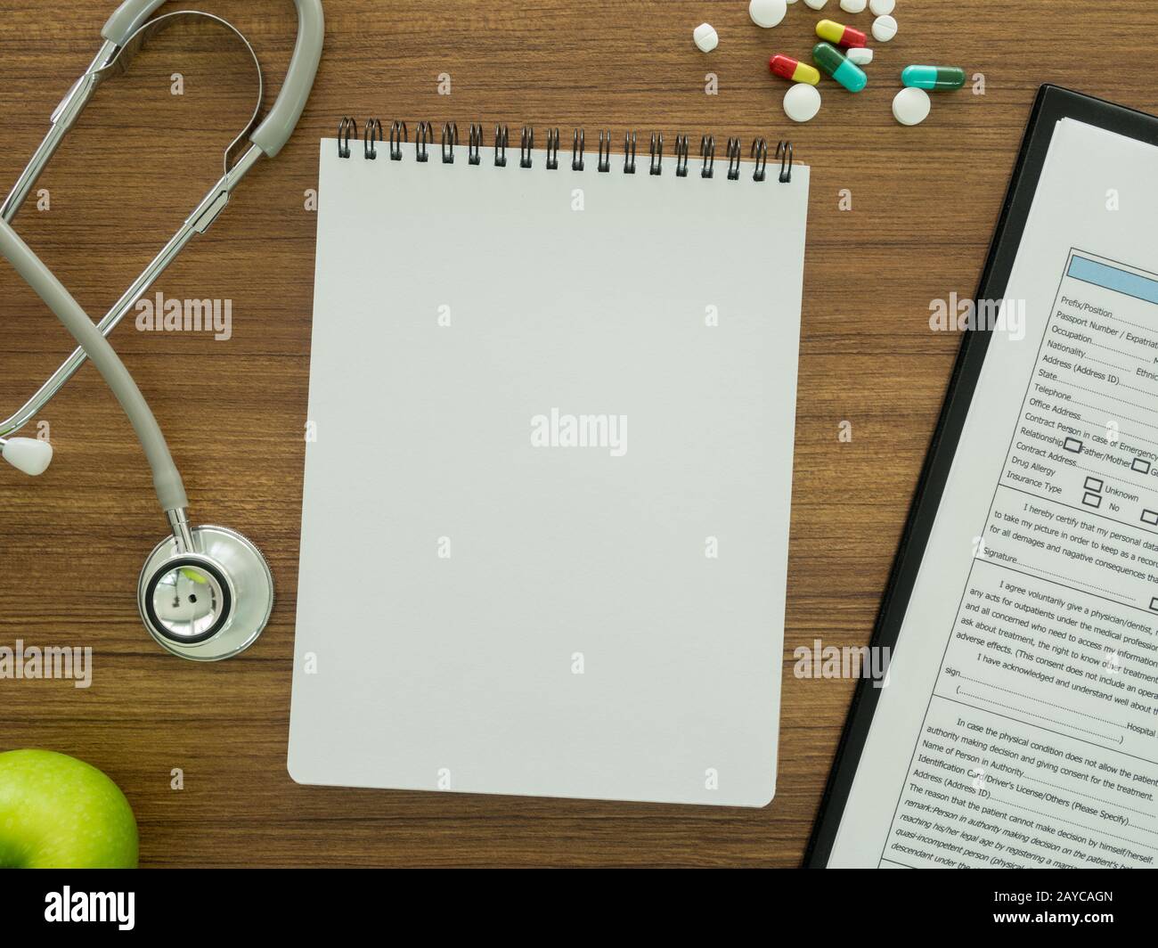 Notebook to record data the patient on a doctor's desk Stock Photo - Alamy