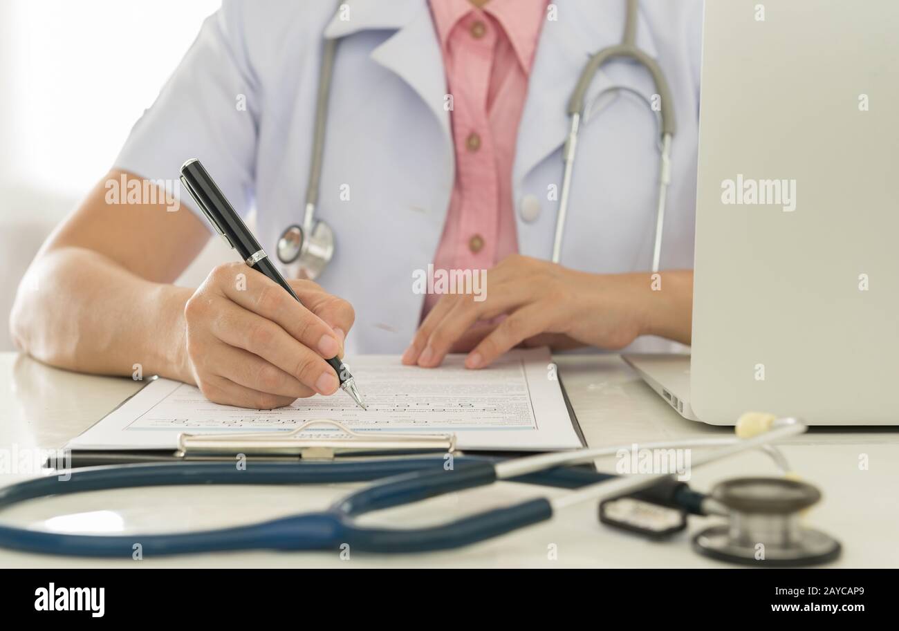 Doctors are recorded patient data for analysis Stock Photo - Alamy