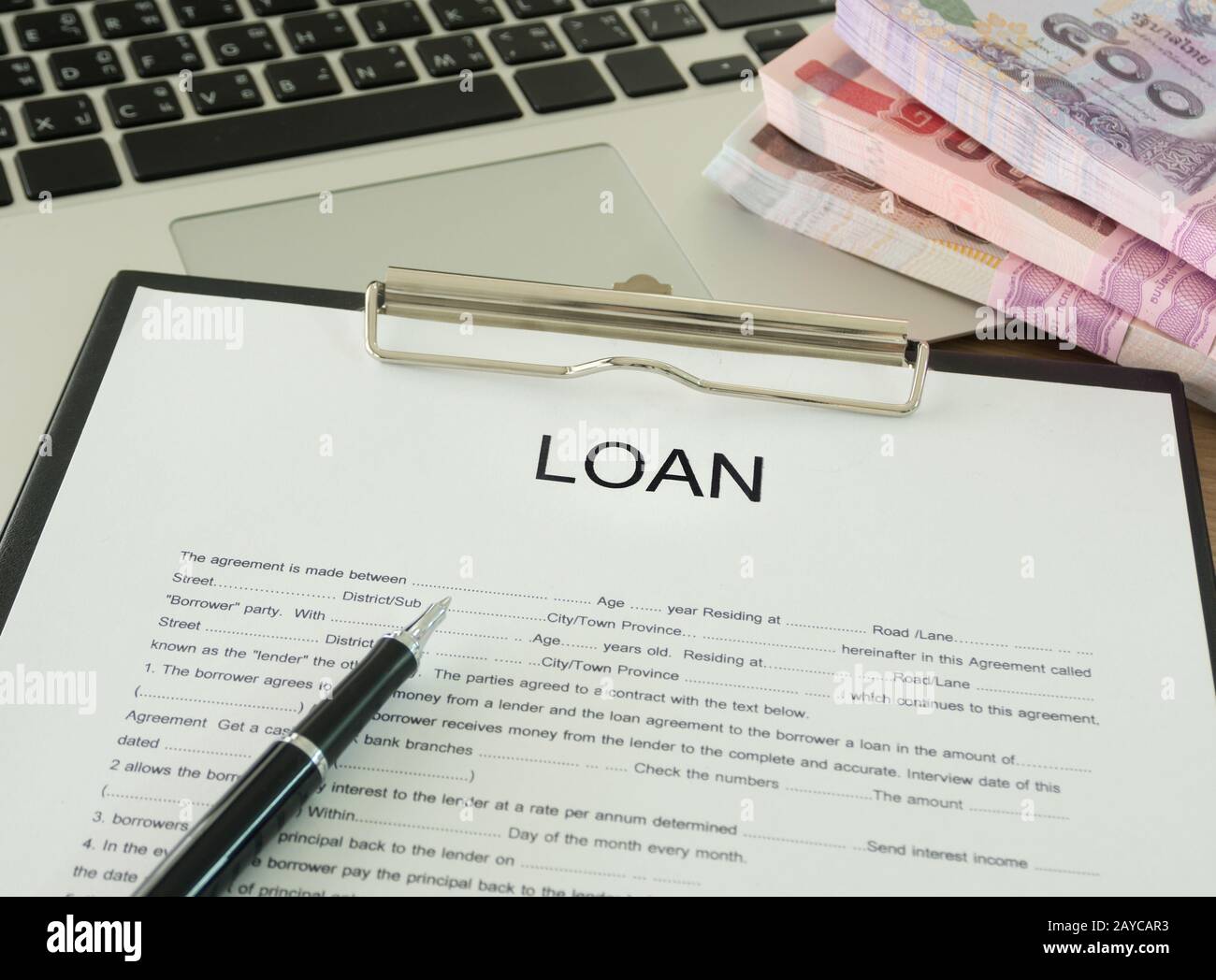 The loan documents and banknotes on desk's bankers Stock Photo - Alamy