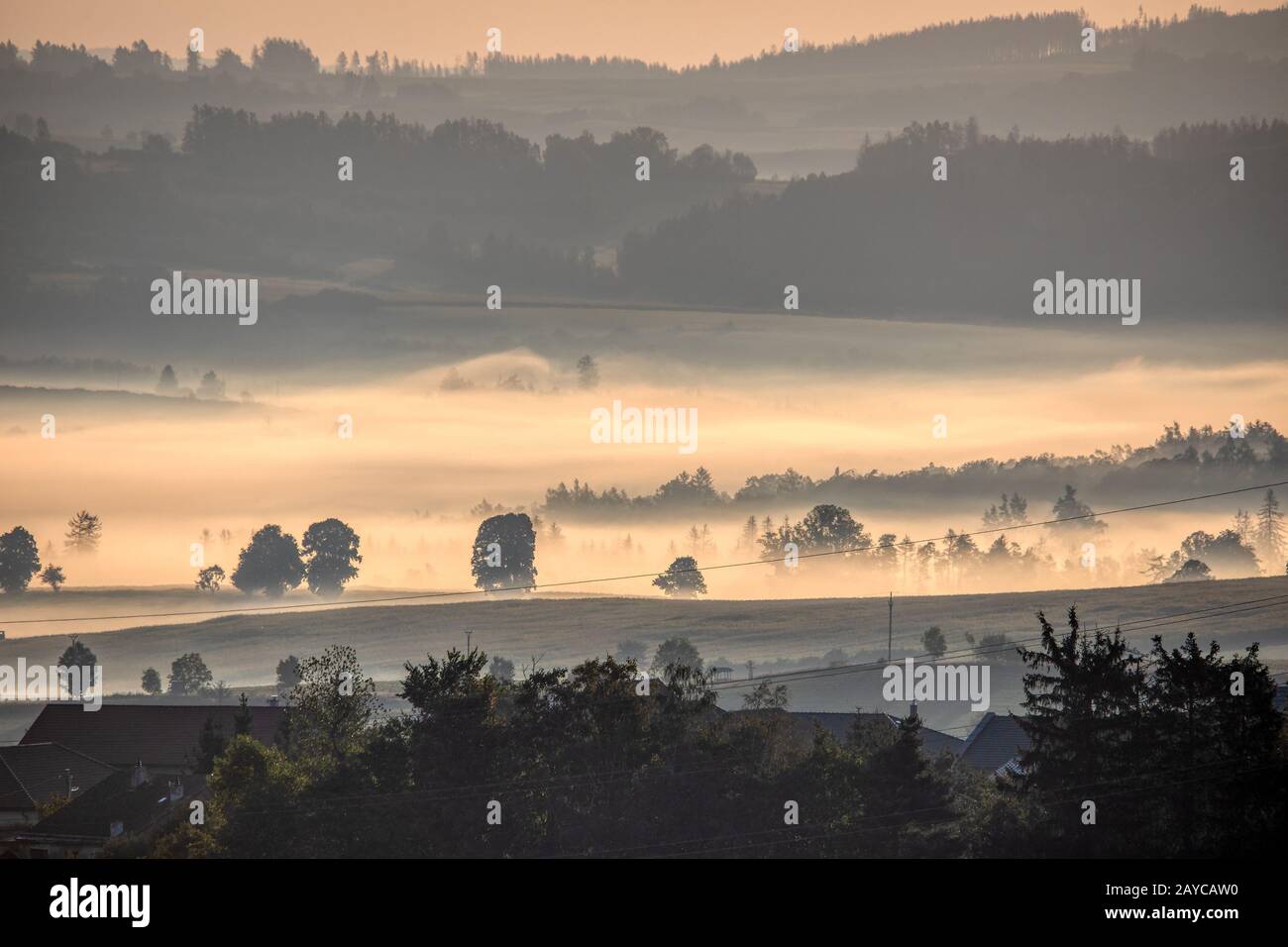 Fall foggy and misty sunrise landscape Stock Photo - Alamy
