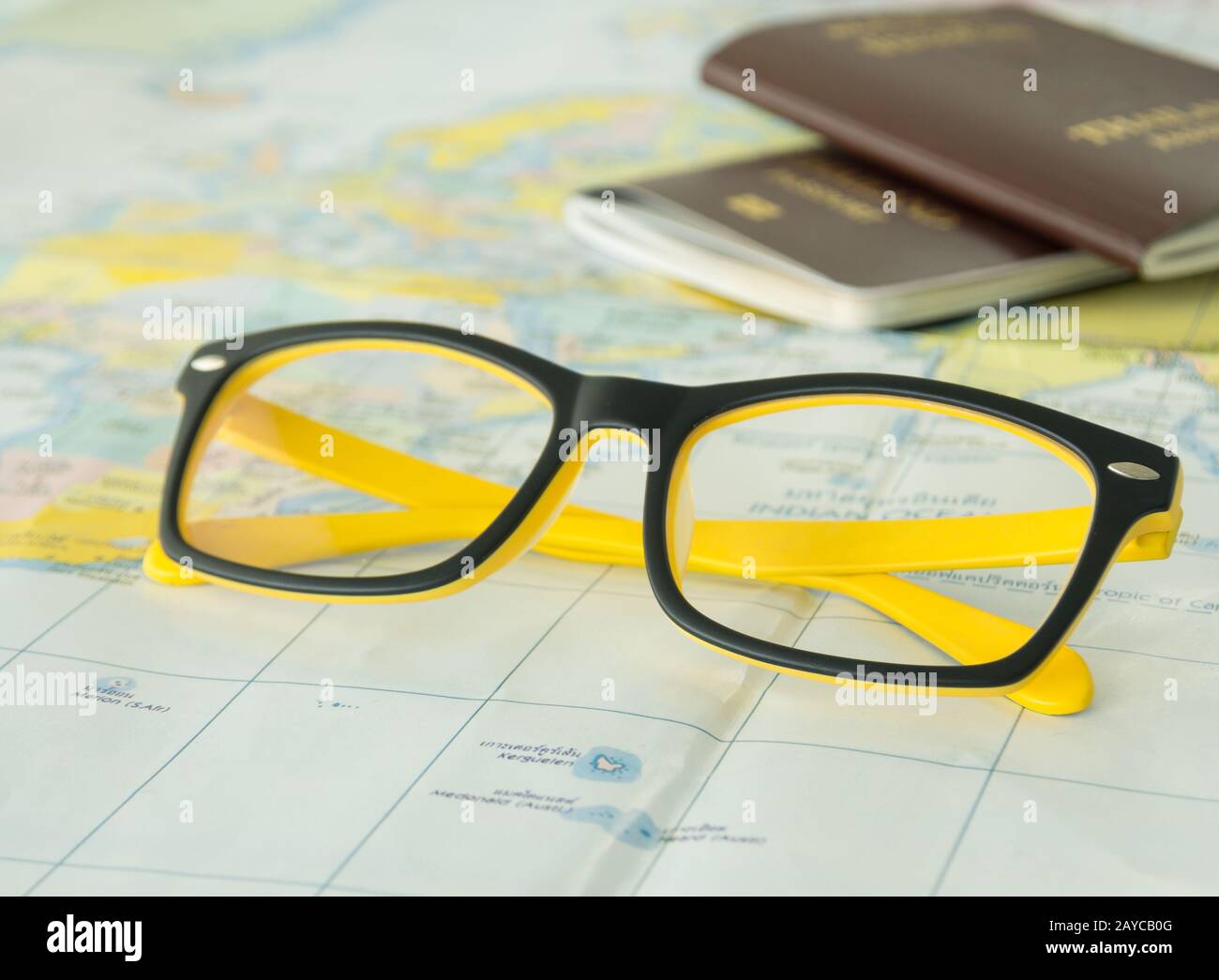 closeup glasses on world map with passport Stock Photo - Alamy