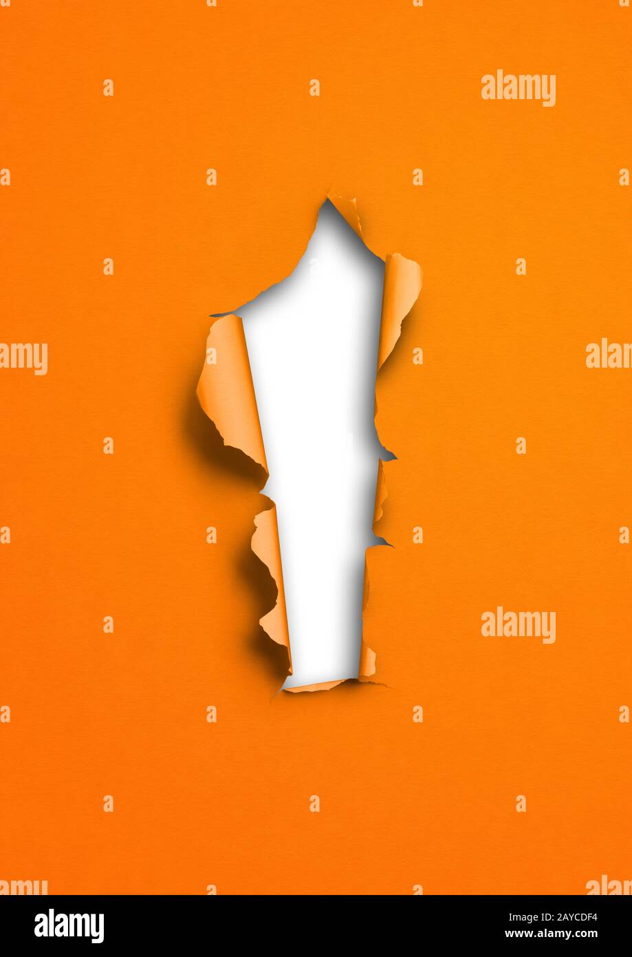 Orange torn paper with hole Stock Photo - Alamy