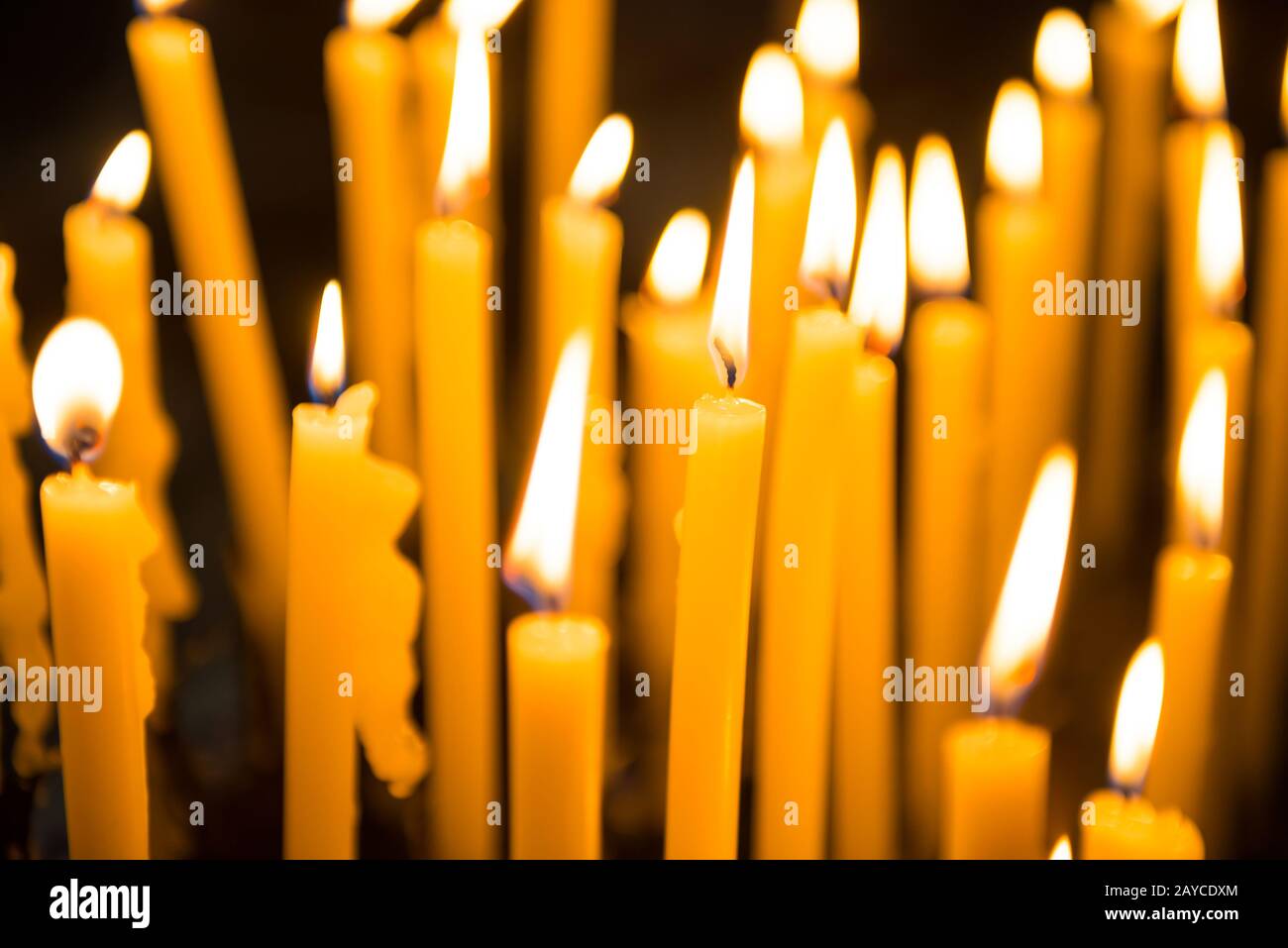Many candles burning in church hi-res stock photography and images - Alamy
