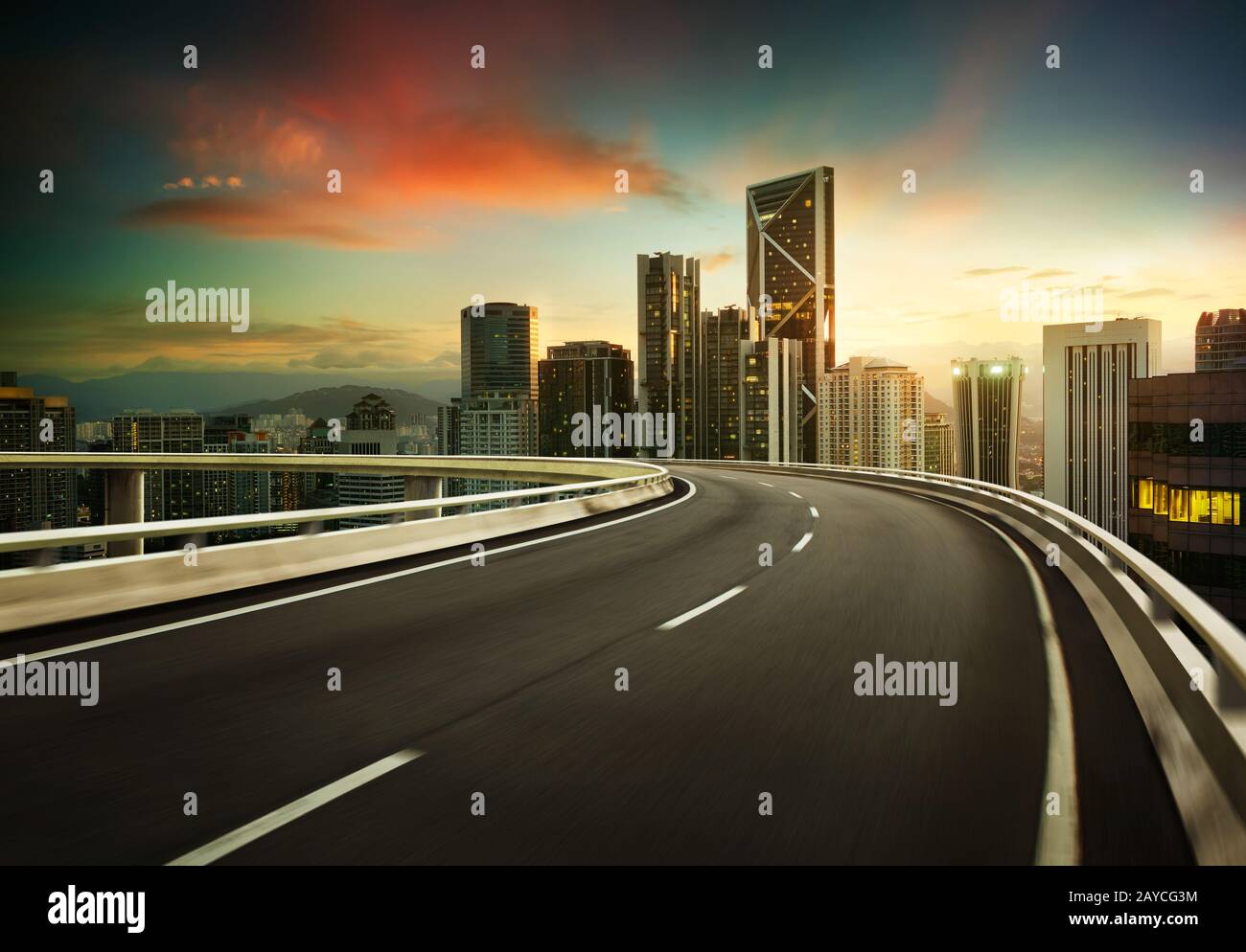 Highway overpass motion blur with city background Stock Photo - Alamy