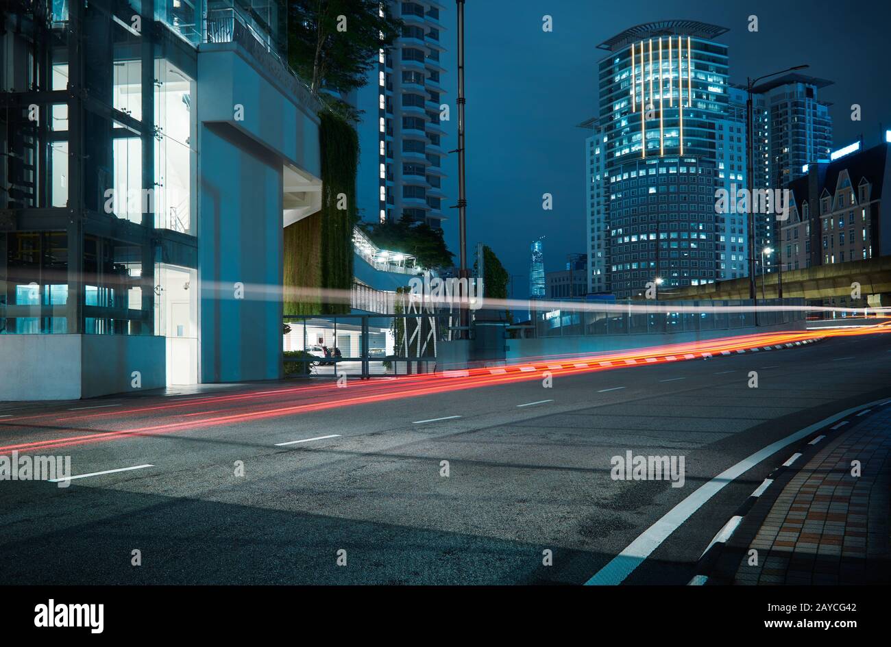 Modern building with light trails on night scene background Stock Photo ...