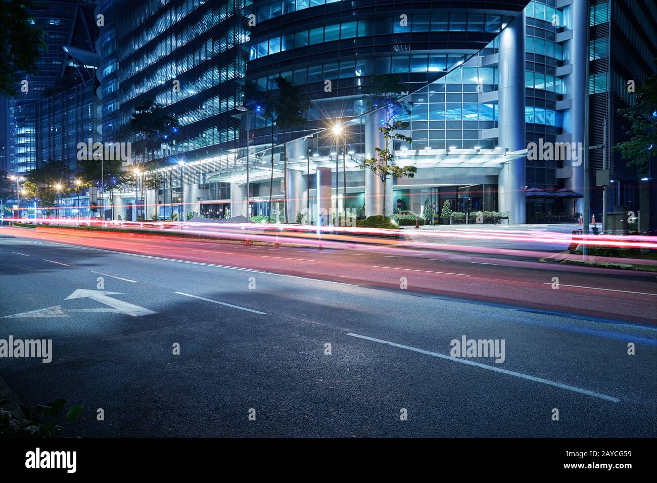 Modern building with light trails on night scene background Stock Photo ...