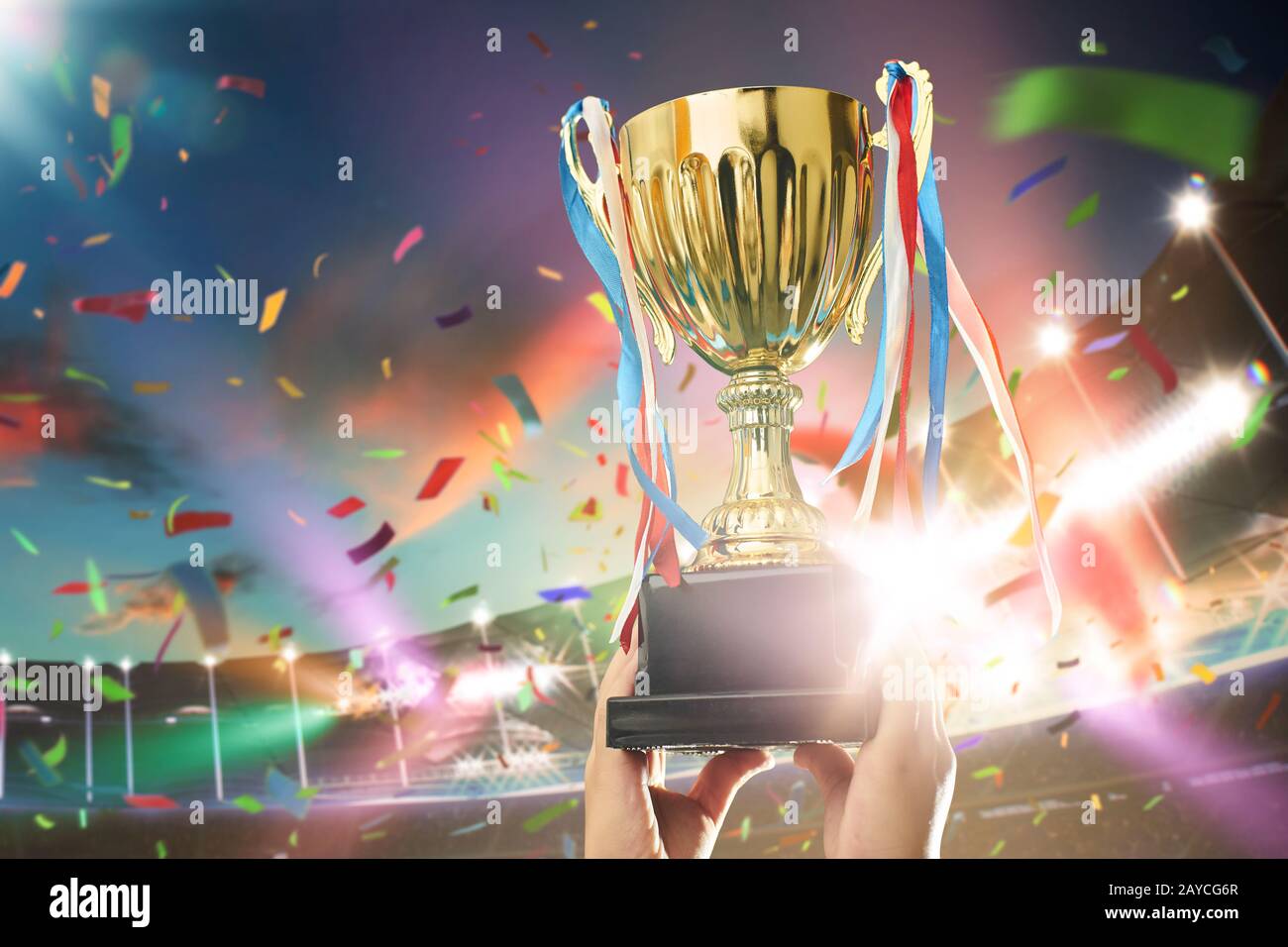 Young athlete holding up a gold trophy cup with space ready for your ...