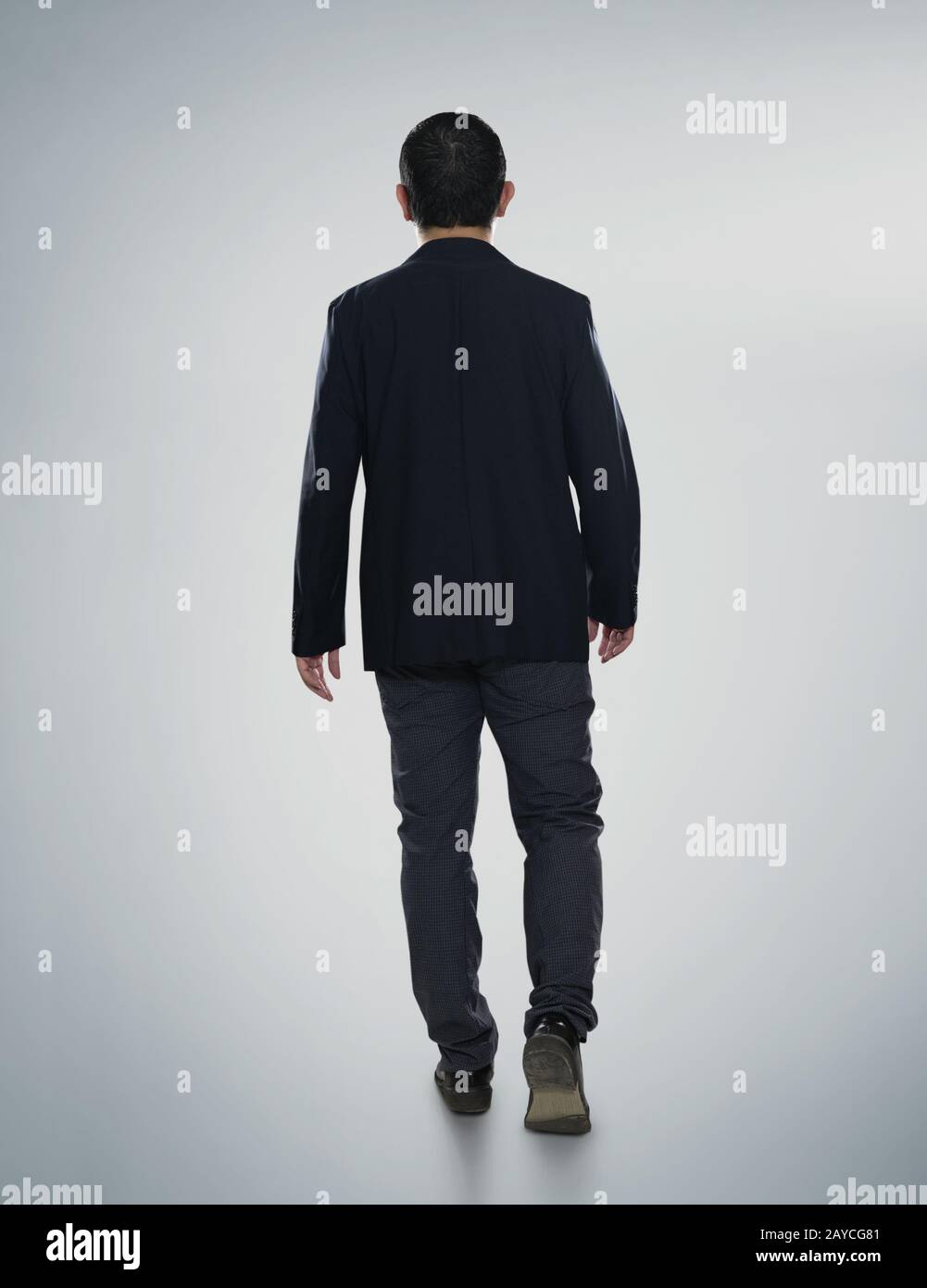 Businessman walking forward Stock Photo - Alamy