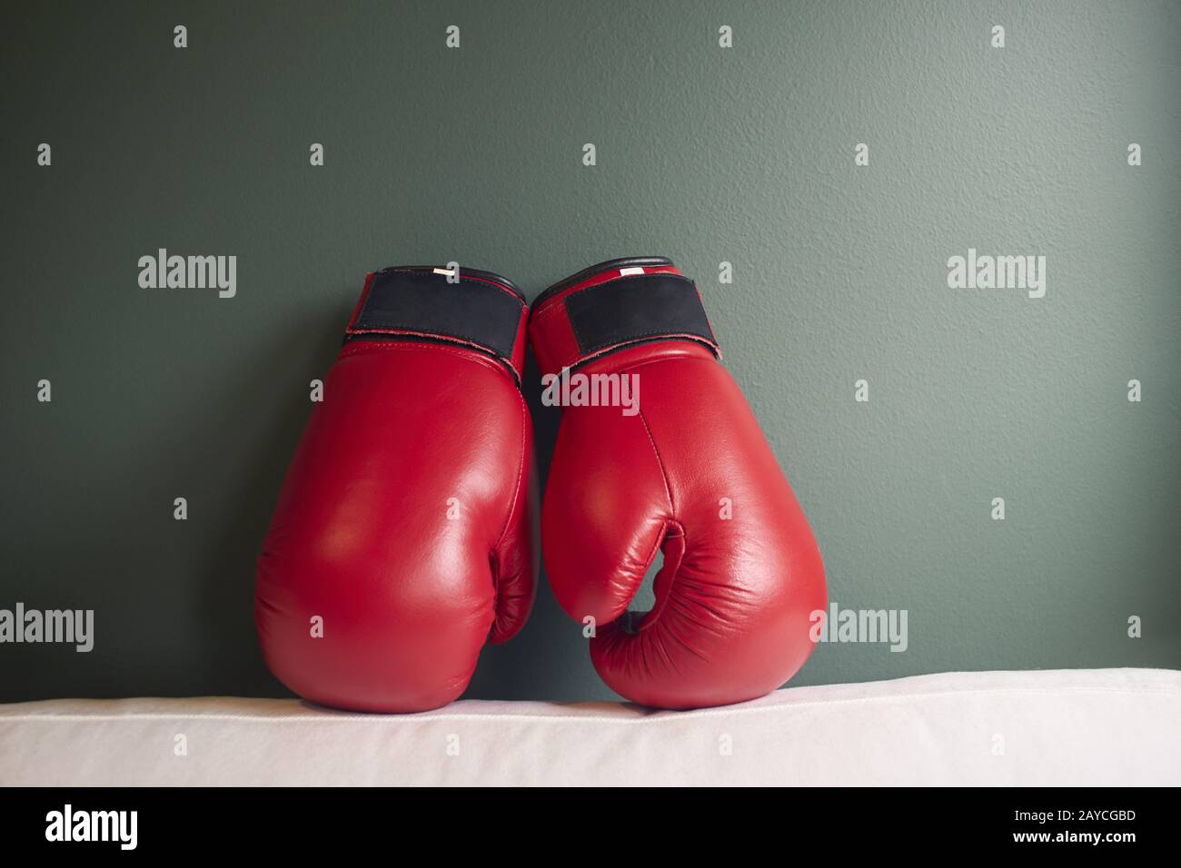 Boxing gloves on a green background Stock Photo - Alamy