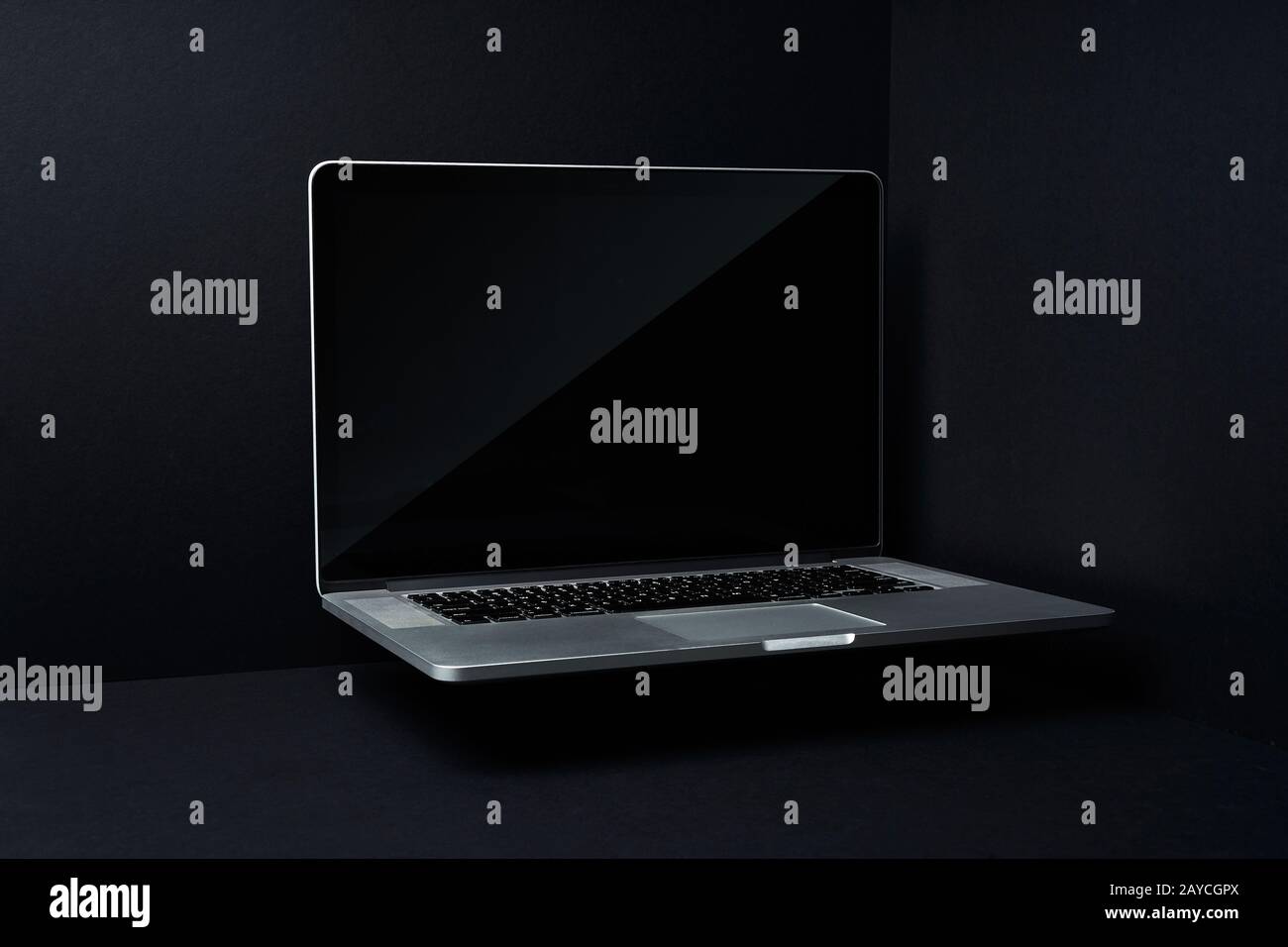 Laptop floating on mockup three dimensional black background Stock ...