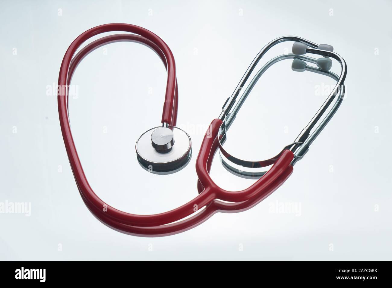 Red color stethoscope with reflection on glossy background Stock Photo ...