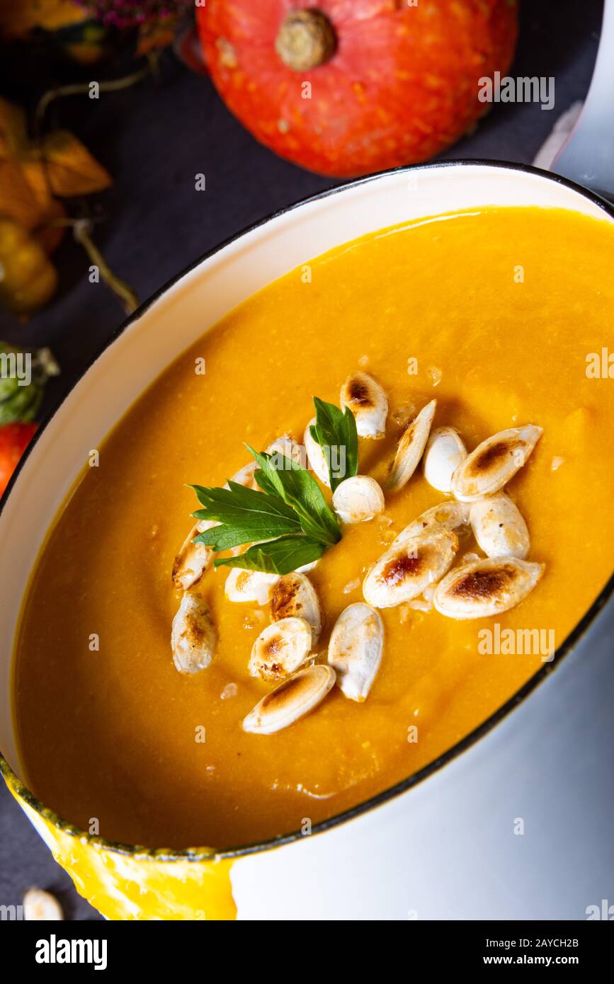 Pumpkin cream soup with roasted pumpkin seeds and seed oil Stock Photo ...