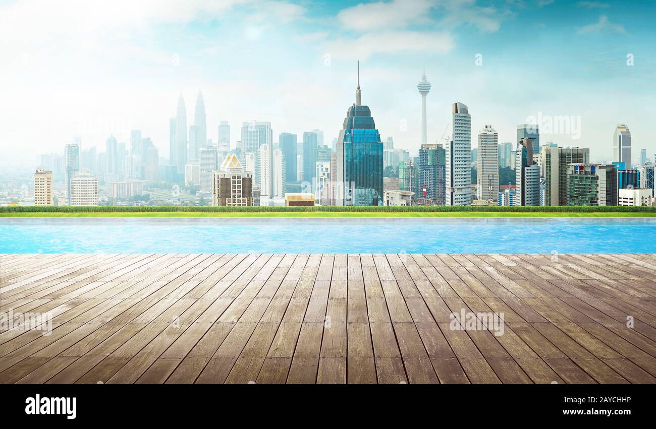 Empty wooden deck with swimming pool Stock Photo - Alamy