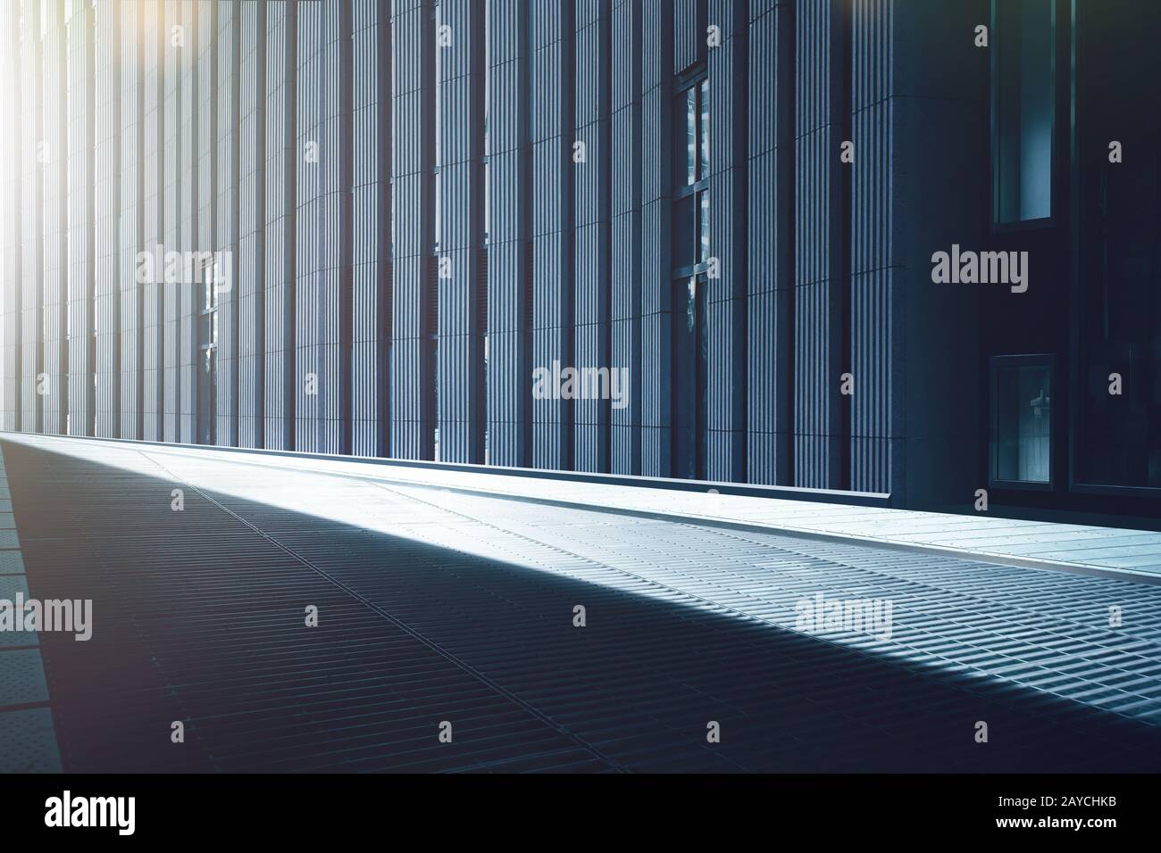 Empty street view of facade with metal and stripes design construction ...