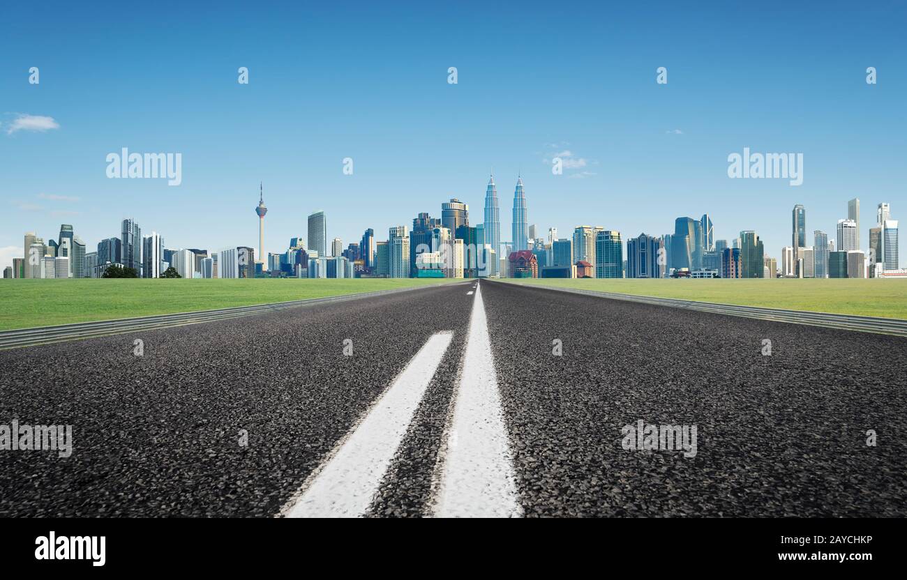 modern asphalt road through modern city skyline Stock Photo - Alamy