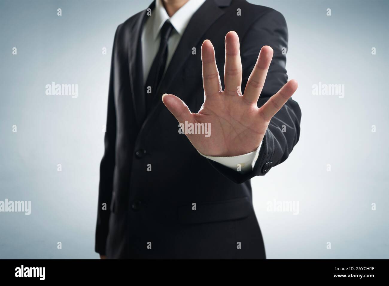 Hand stop shown by businessman Stock Photo - Alamy