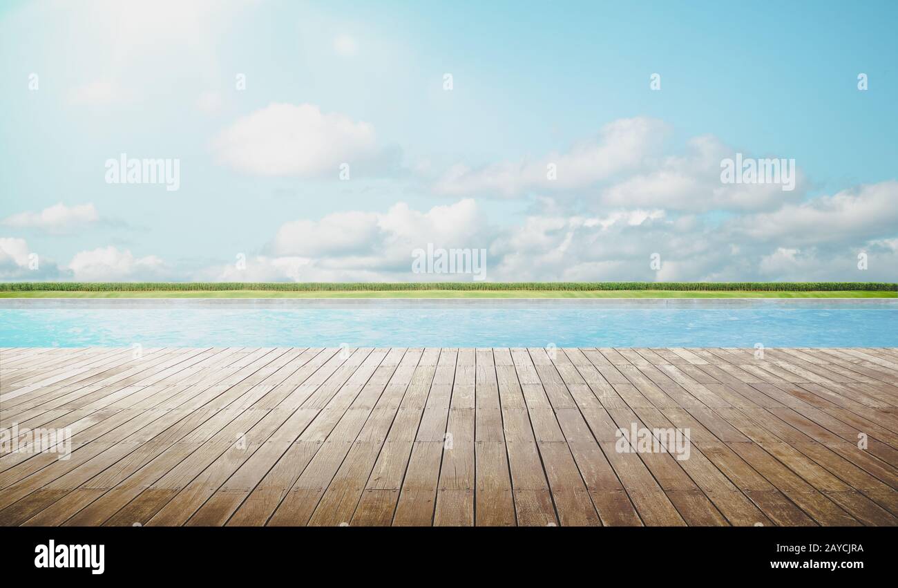 Empty wooden deck with swimming pool Stock Photo - Alamy