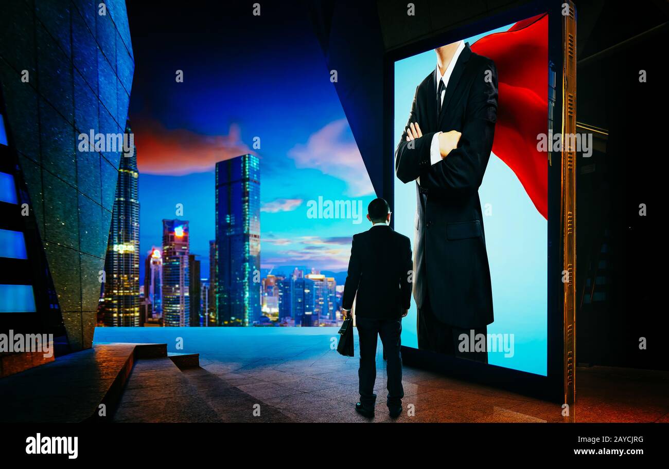 Young businessman looking the hero businessman on the advertising ...