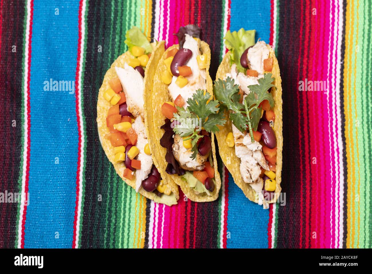 three Mexican tacos on slate Stock Photo - Alamy